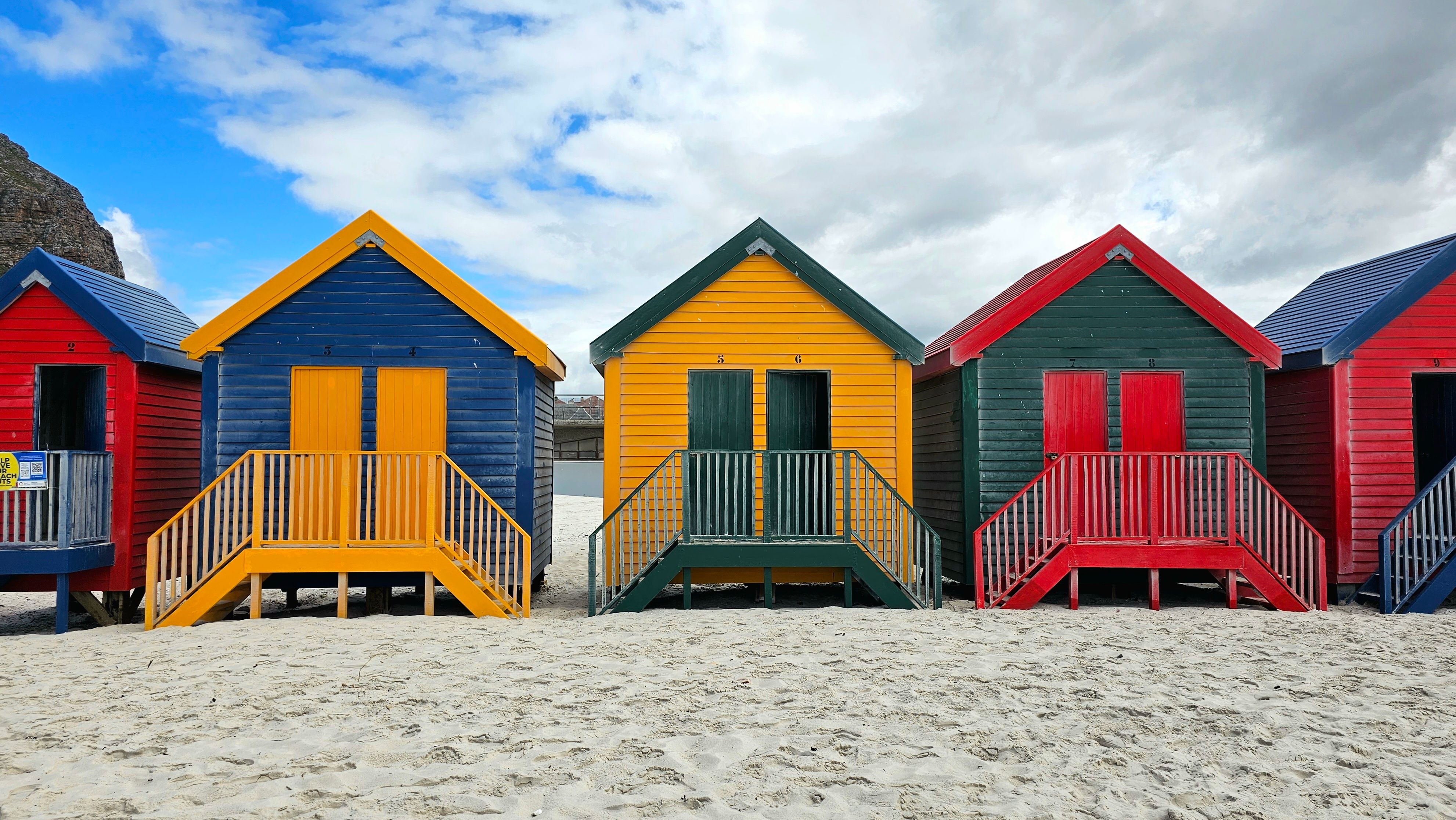 Row of Colorful Huts on Beach · Free Stock Photo