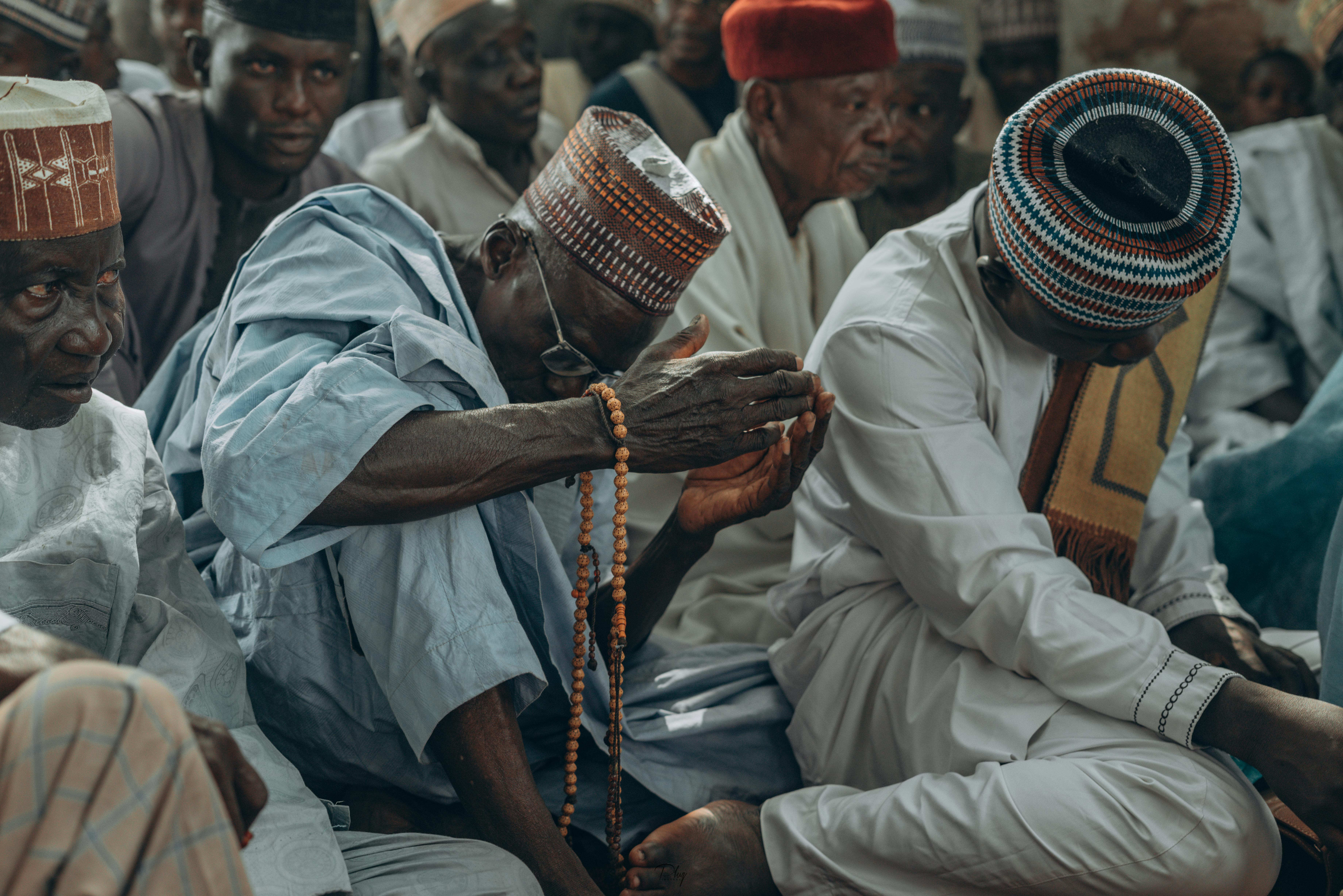 Men Sitting in Traditional Clothing in Gathering · Free Stock Photo