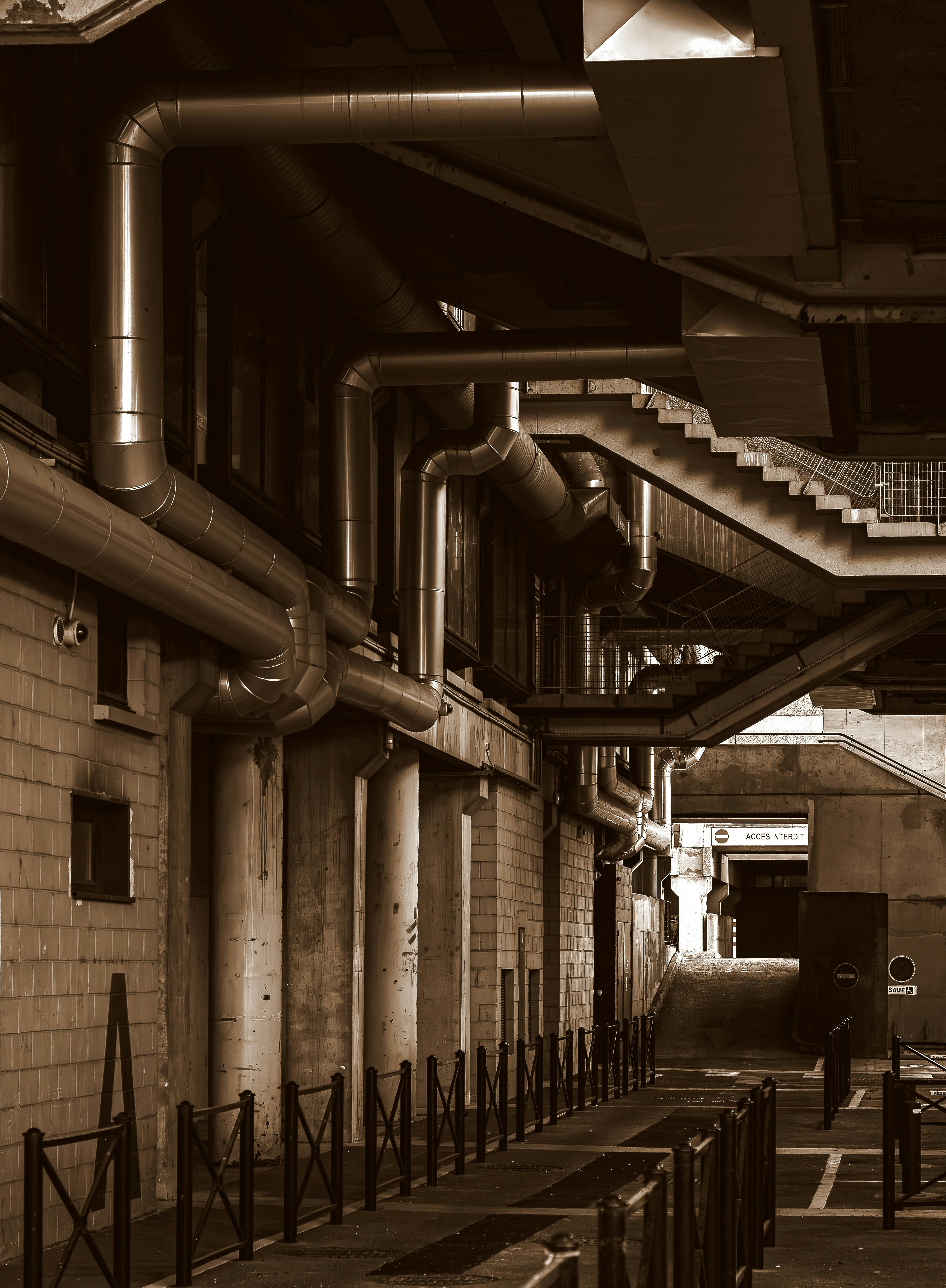 Pipes on Building Wall · Free Stock Photo