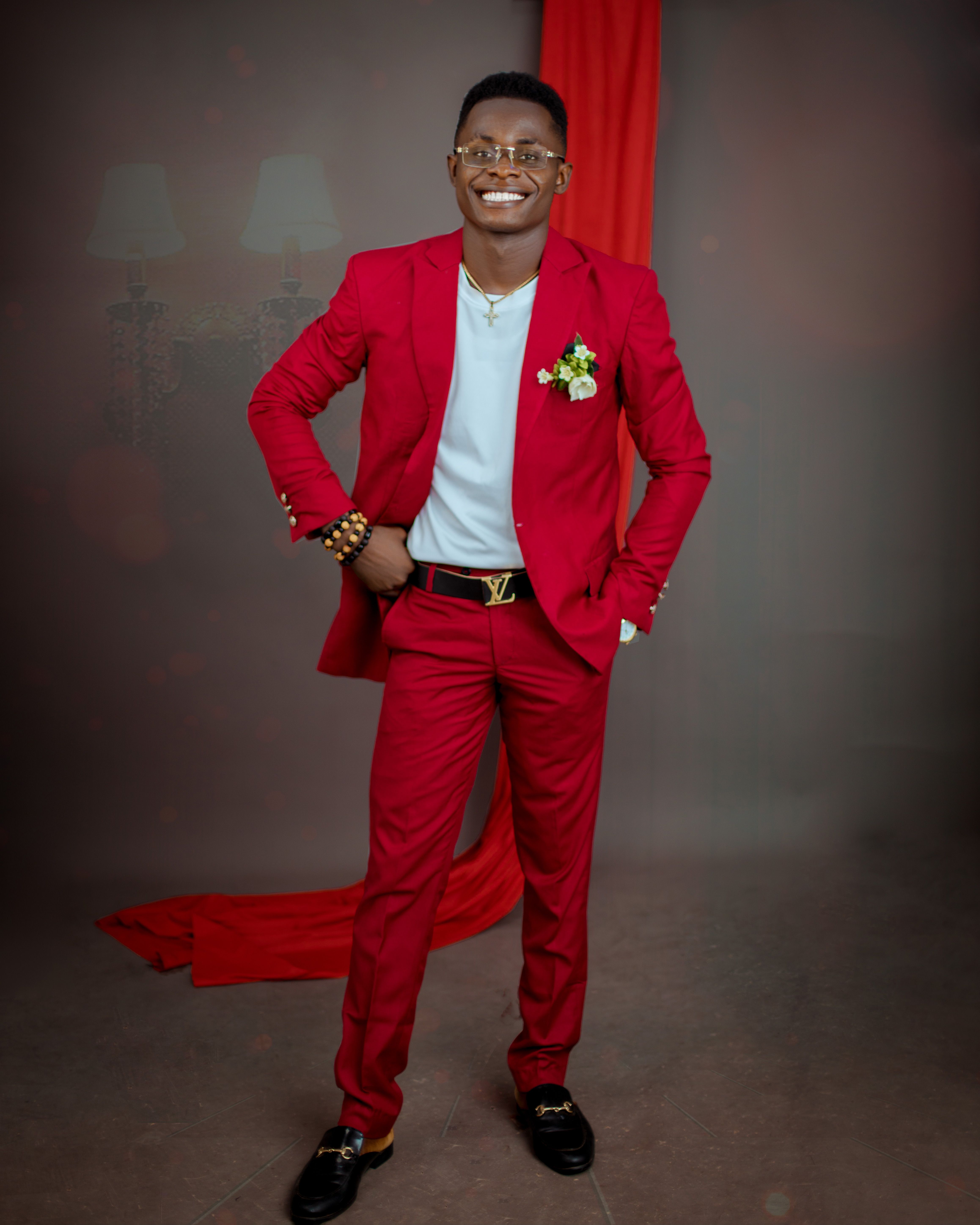 Smiling Man in Red Suit · Free Stock Photo