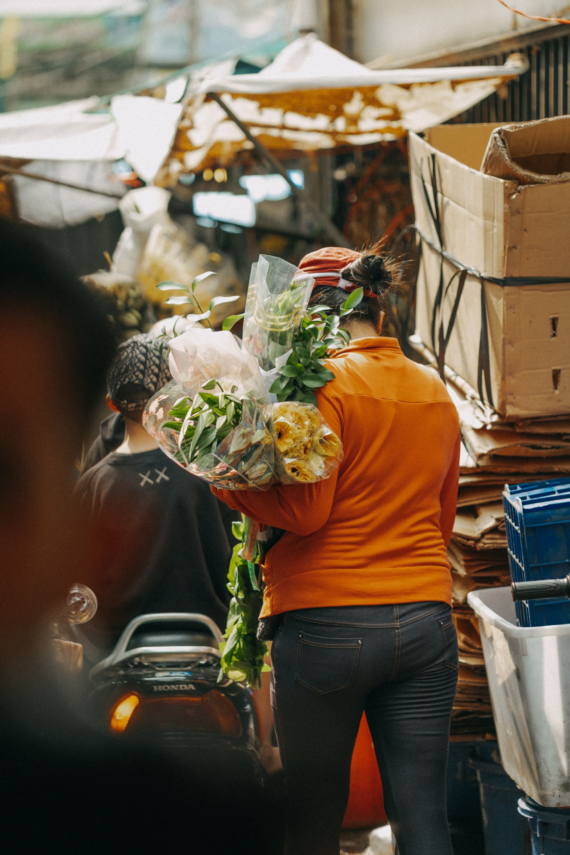 Woman Carrying Flowers · Free Stock Photo