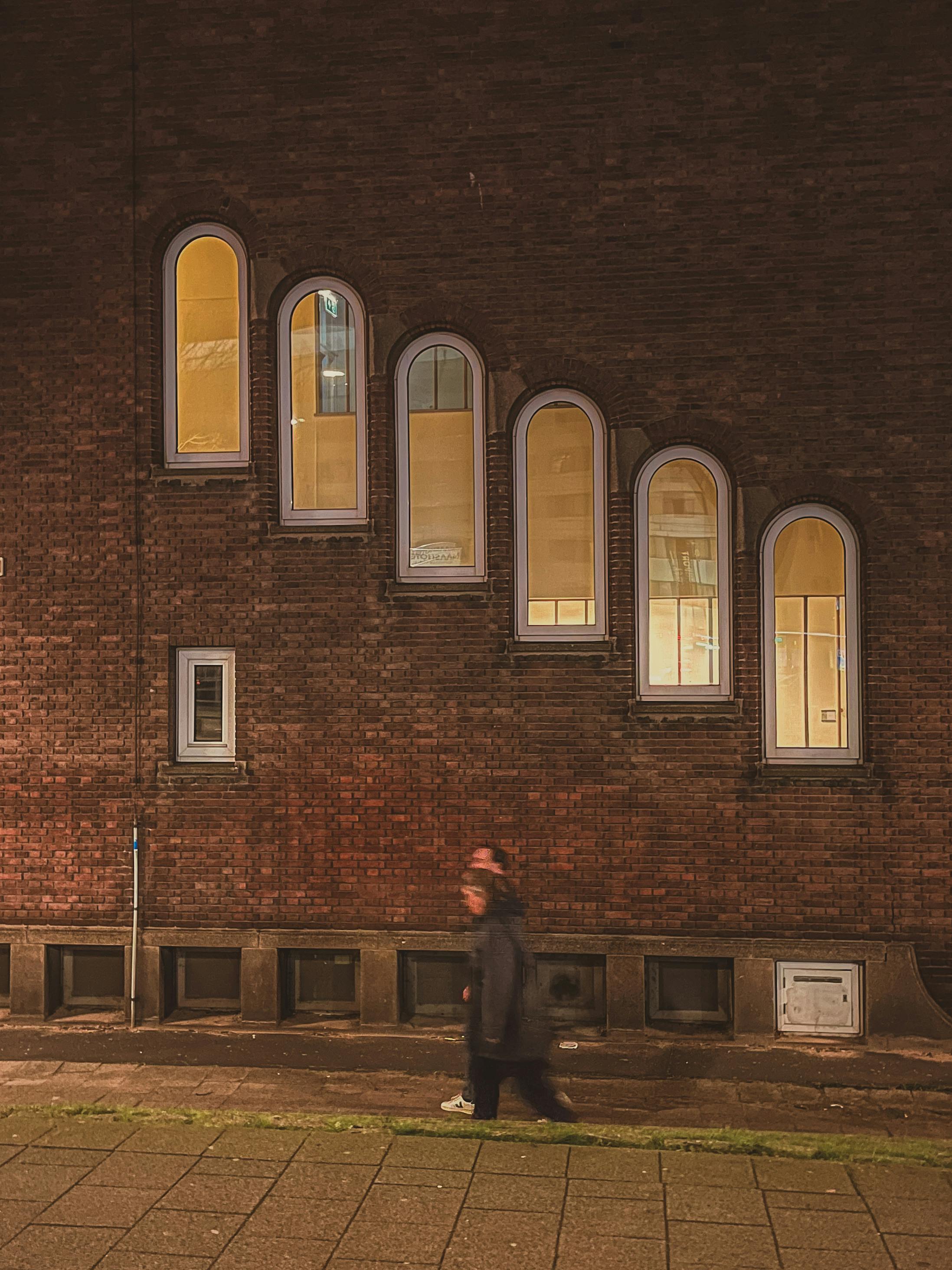 Arched Windows Diagonally in the Wall of a Brick Building · Free Stock ...