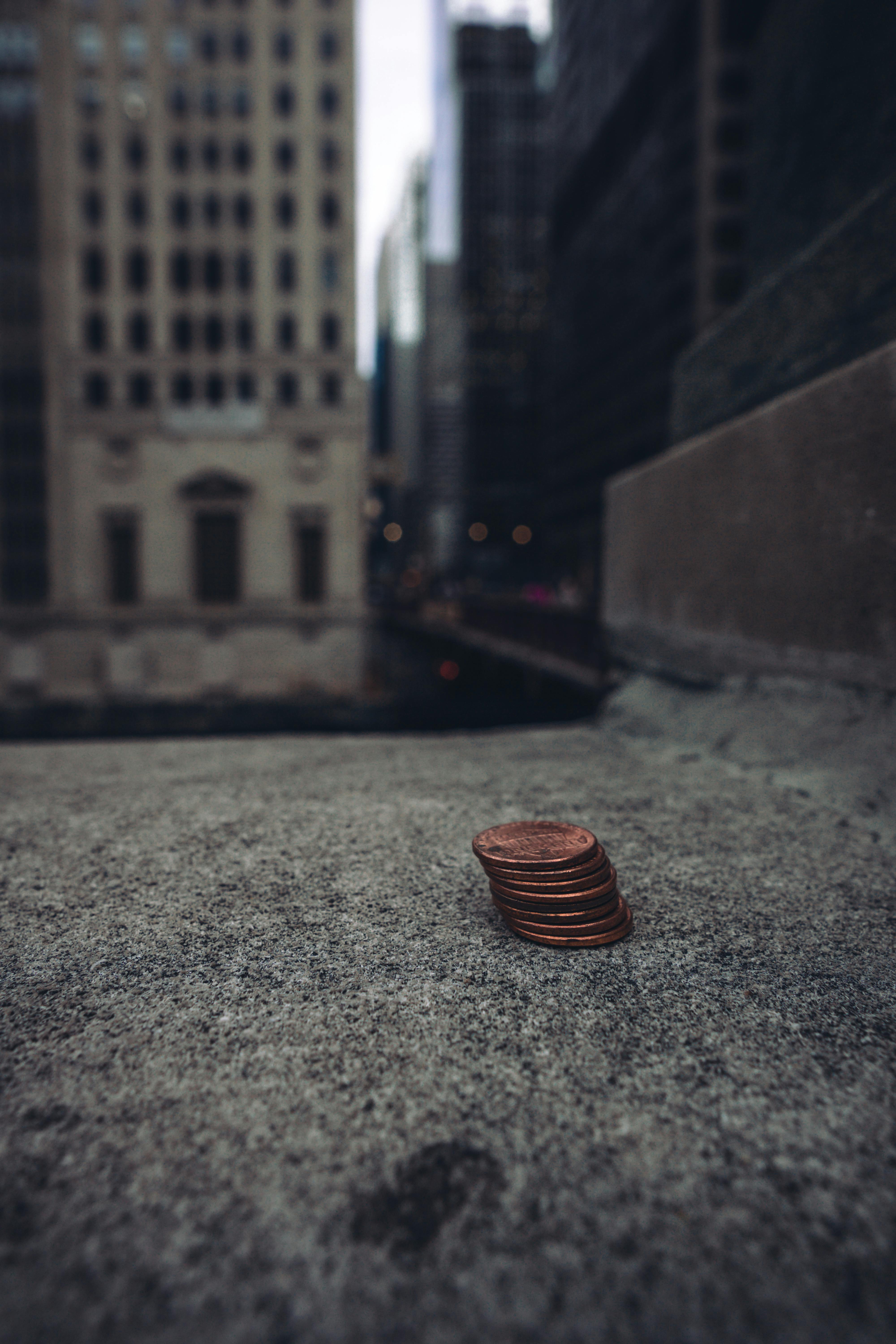 Coins on Concrete in Downtown · Free Stock Photo