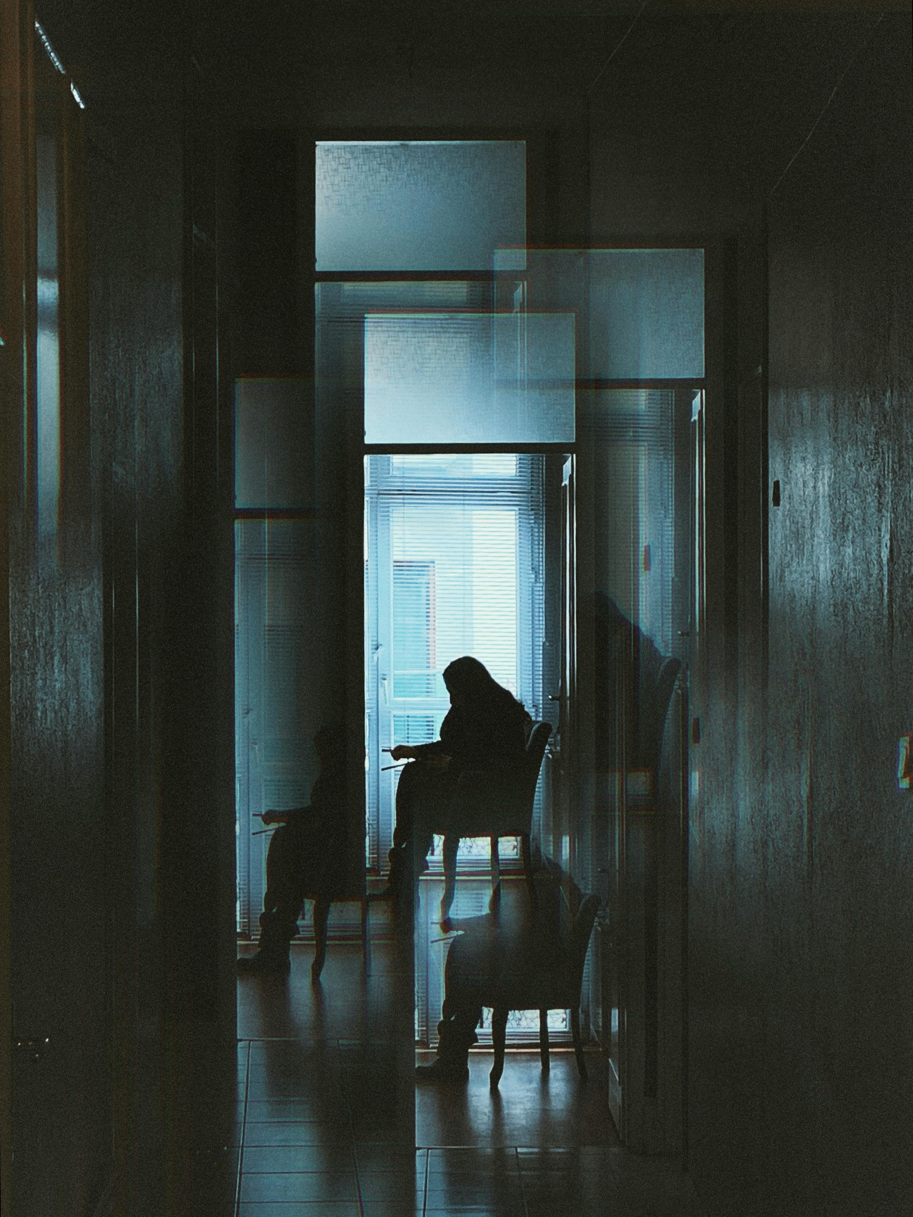 Blurred Person Sitting on Chair · Free Stock Photo