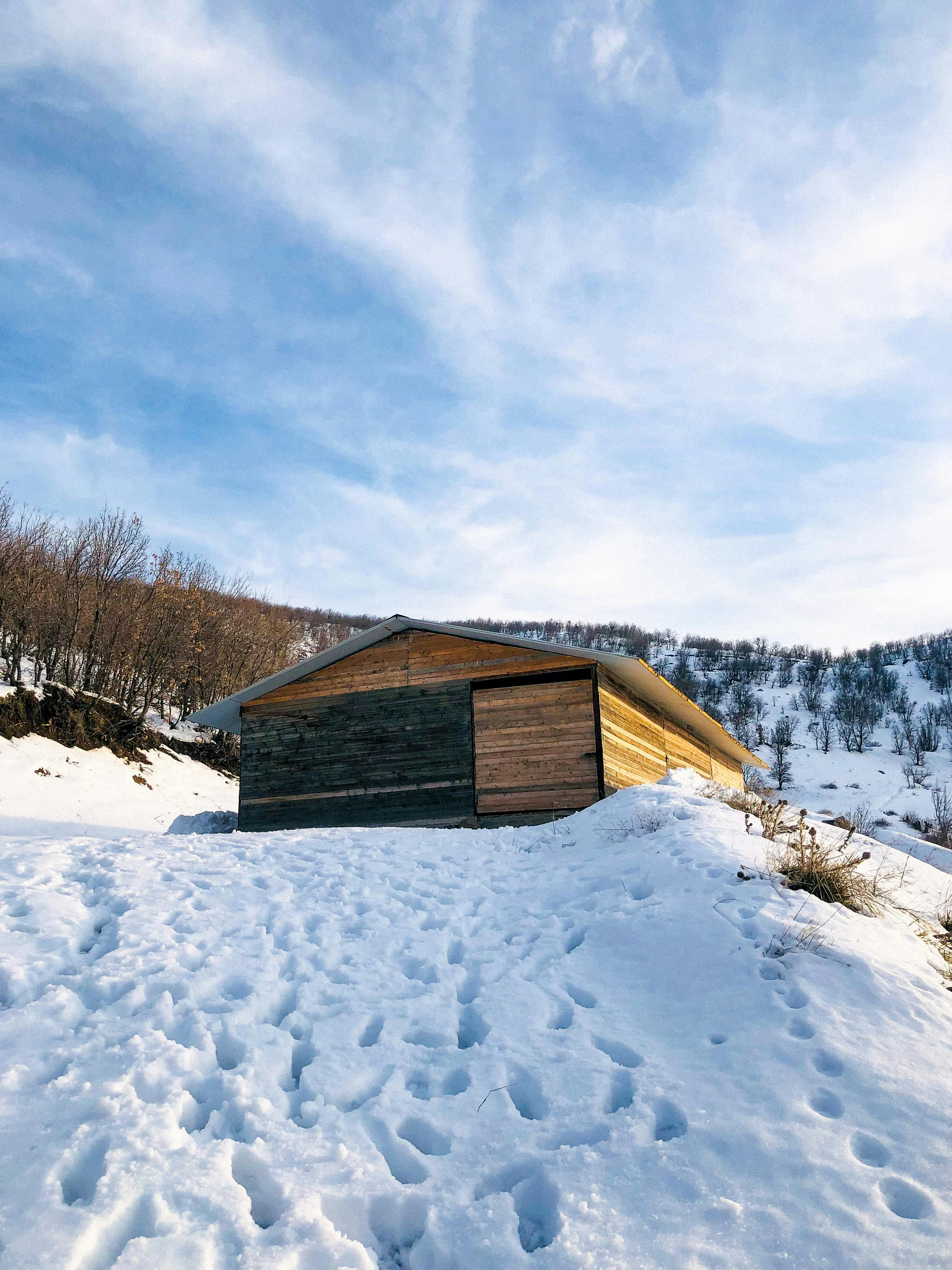 Wooden Building on Hill in Snow · Free Stock Photo