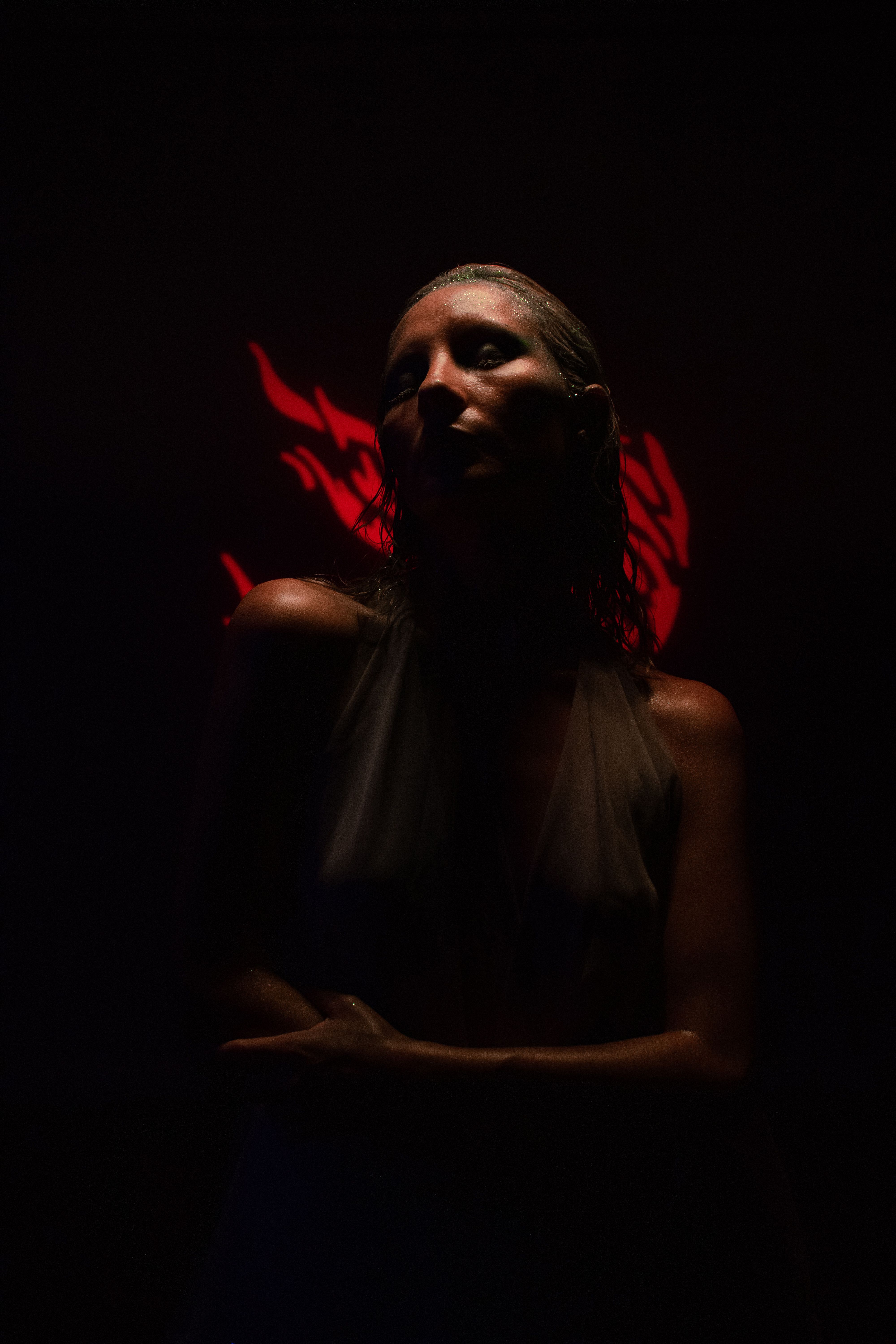 Artistic Portrait with Dramatic Red Lighting · Free Stock Photo