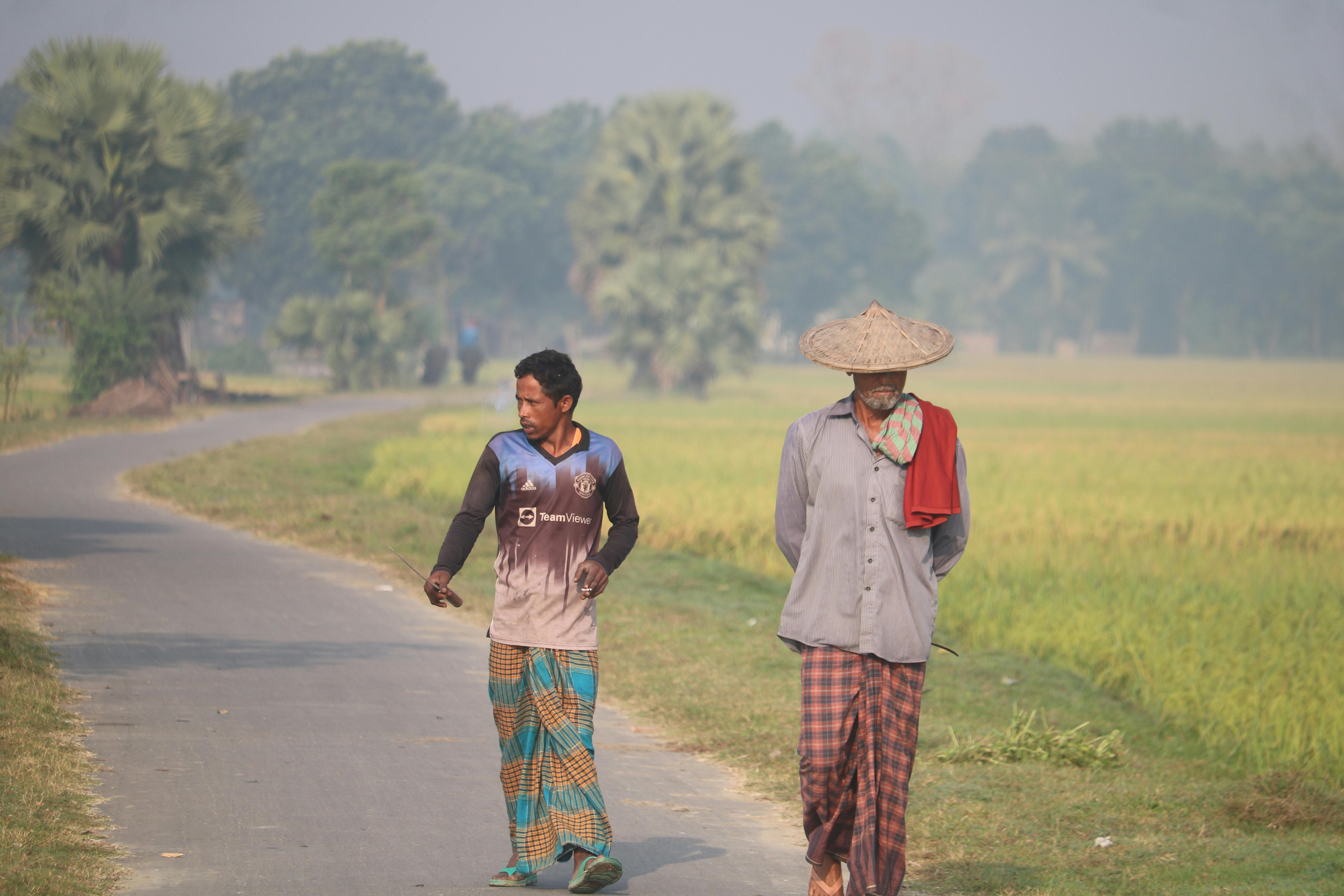 Two Men Walking in Countryside · Free Stock Photo
