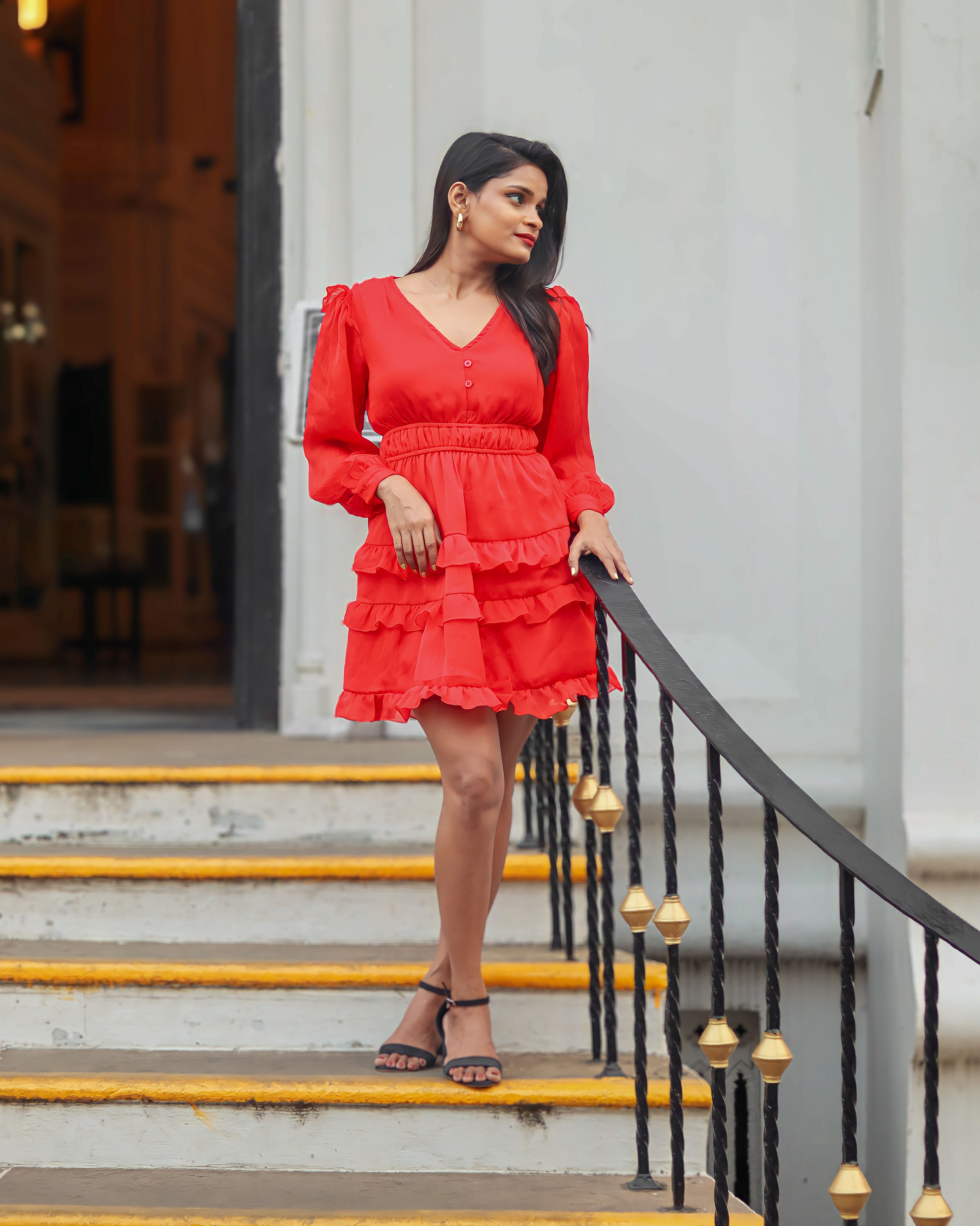 Brunette in Red Dress on Steps · Free Stock Photo