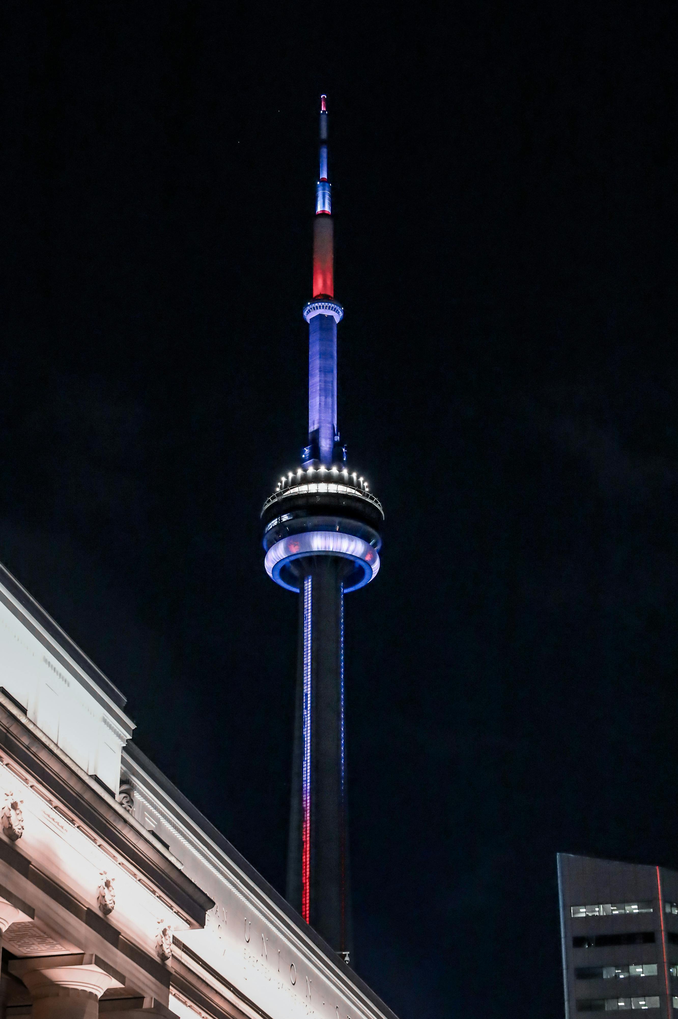 Low Angle Shot of Illuminated CN Tower in Toronto at Night · Free Stock ...