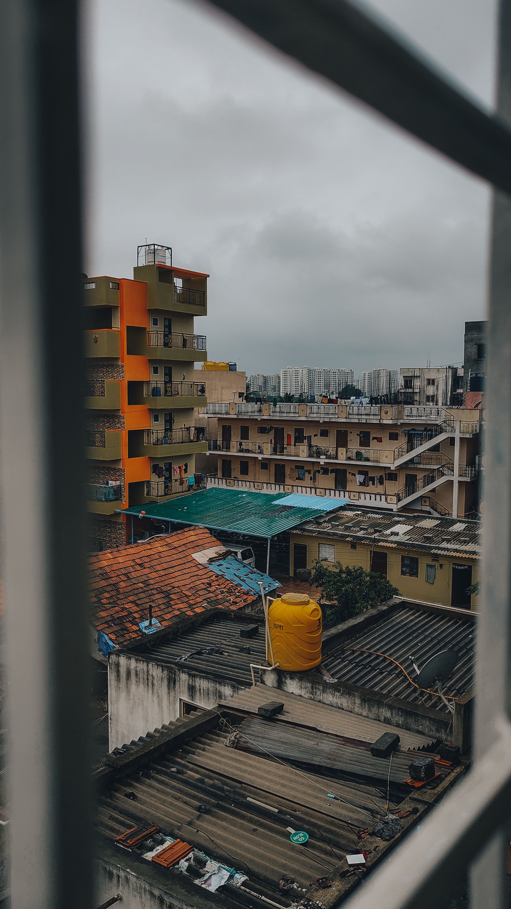 Residential Buildings in City behind Window · Free Stock Photo