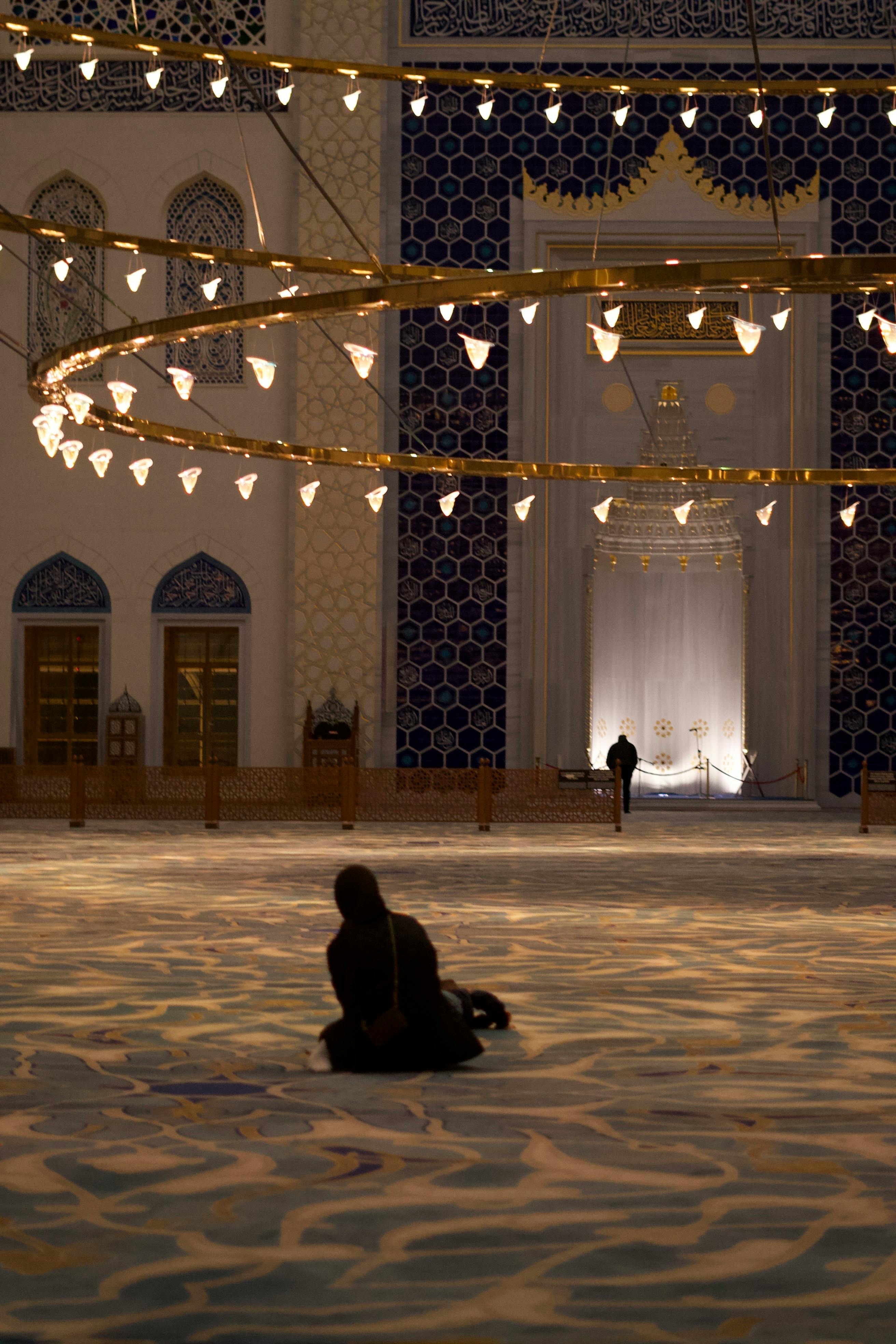 Woman Sitting and Praying at Mosque · Free Stock Photo