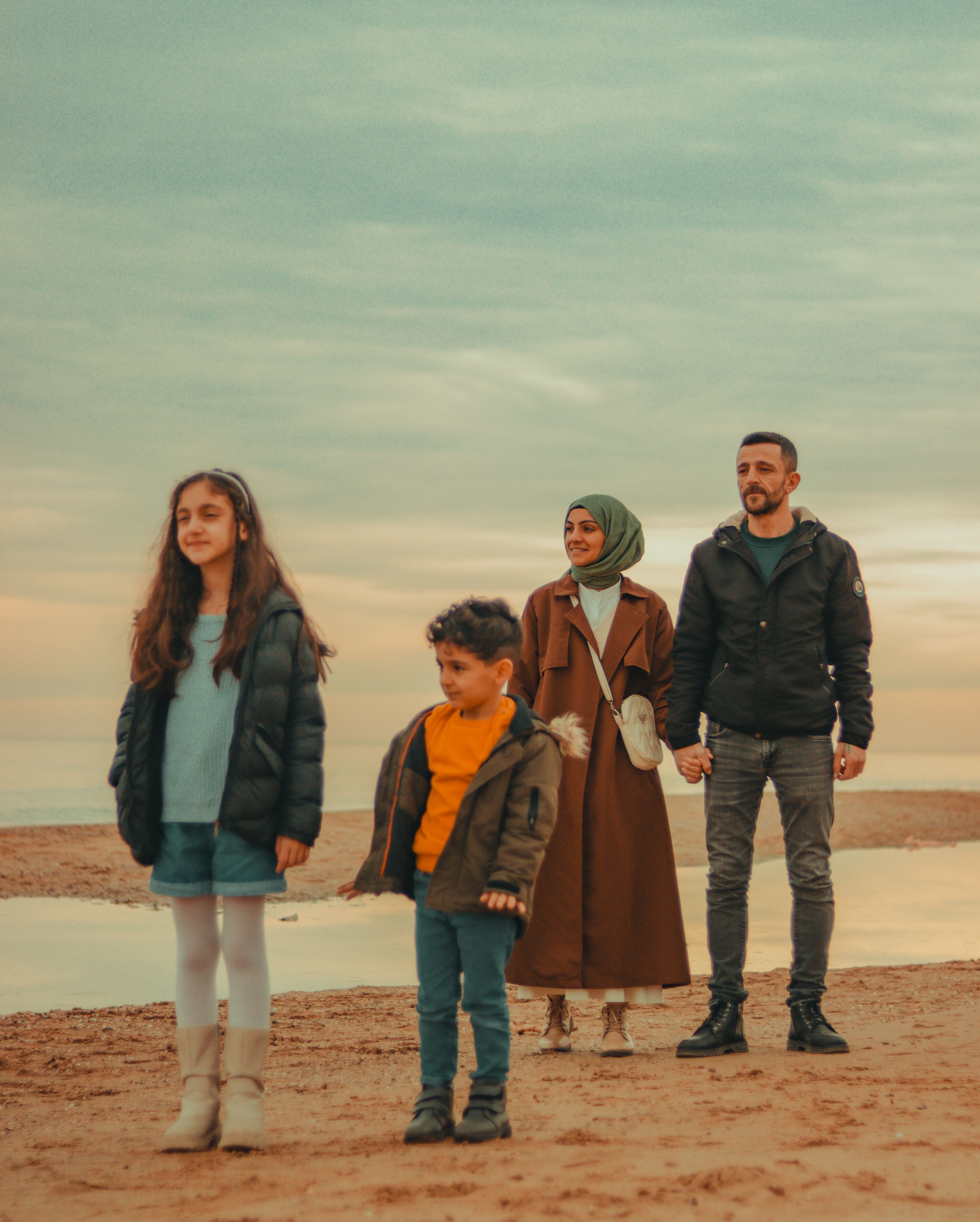 Children and Parents Standing behind by River at Sunset · Free Stock Photo