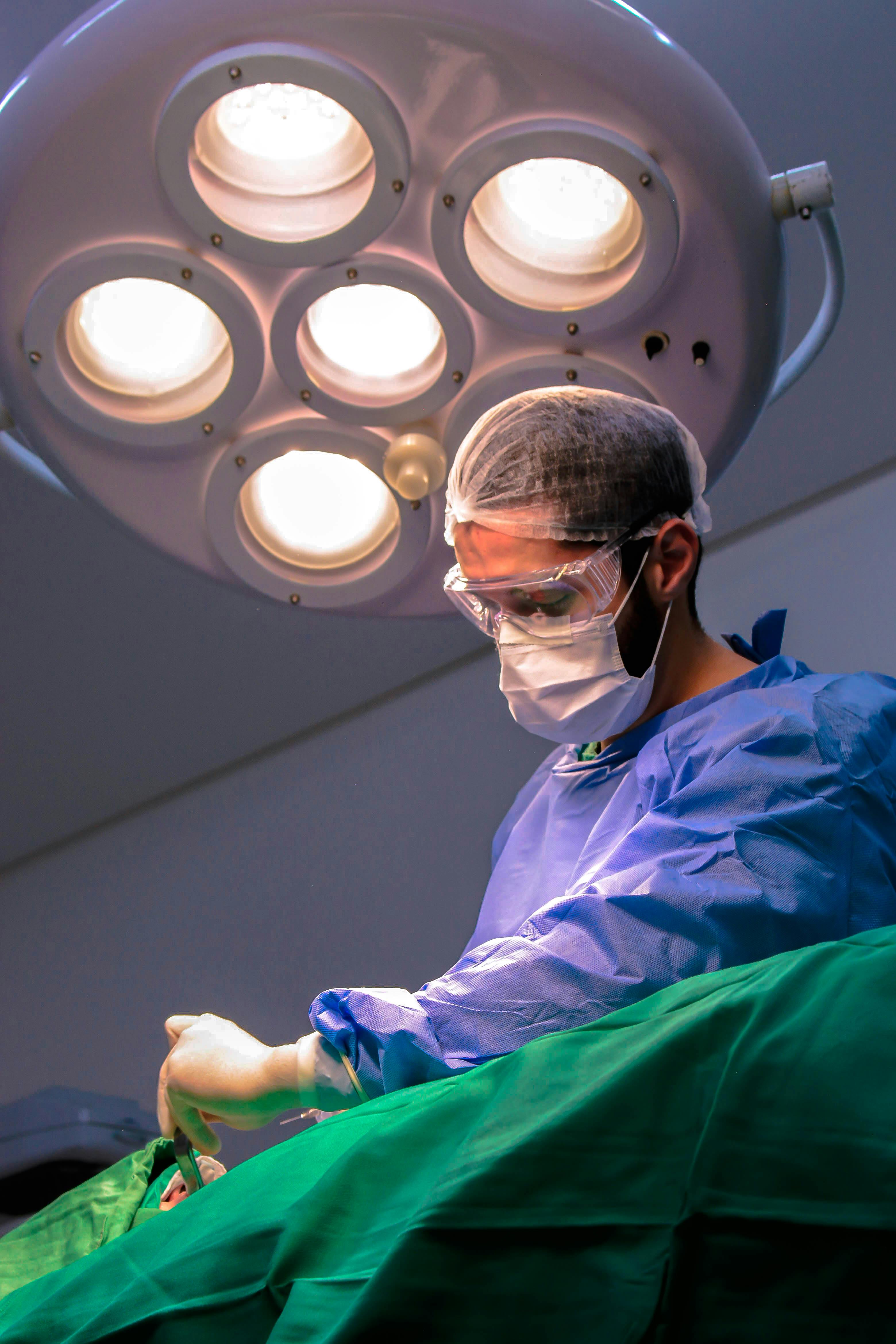 Two Person Doing Surgery Inside Room · Free Stock Photo