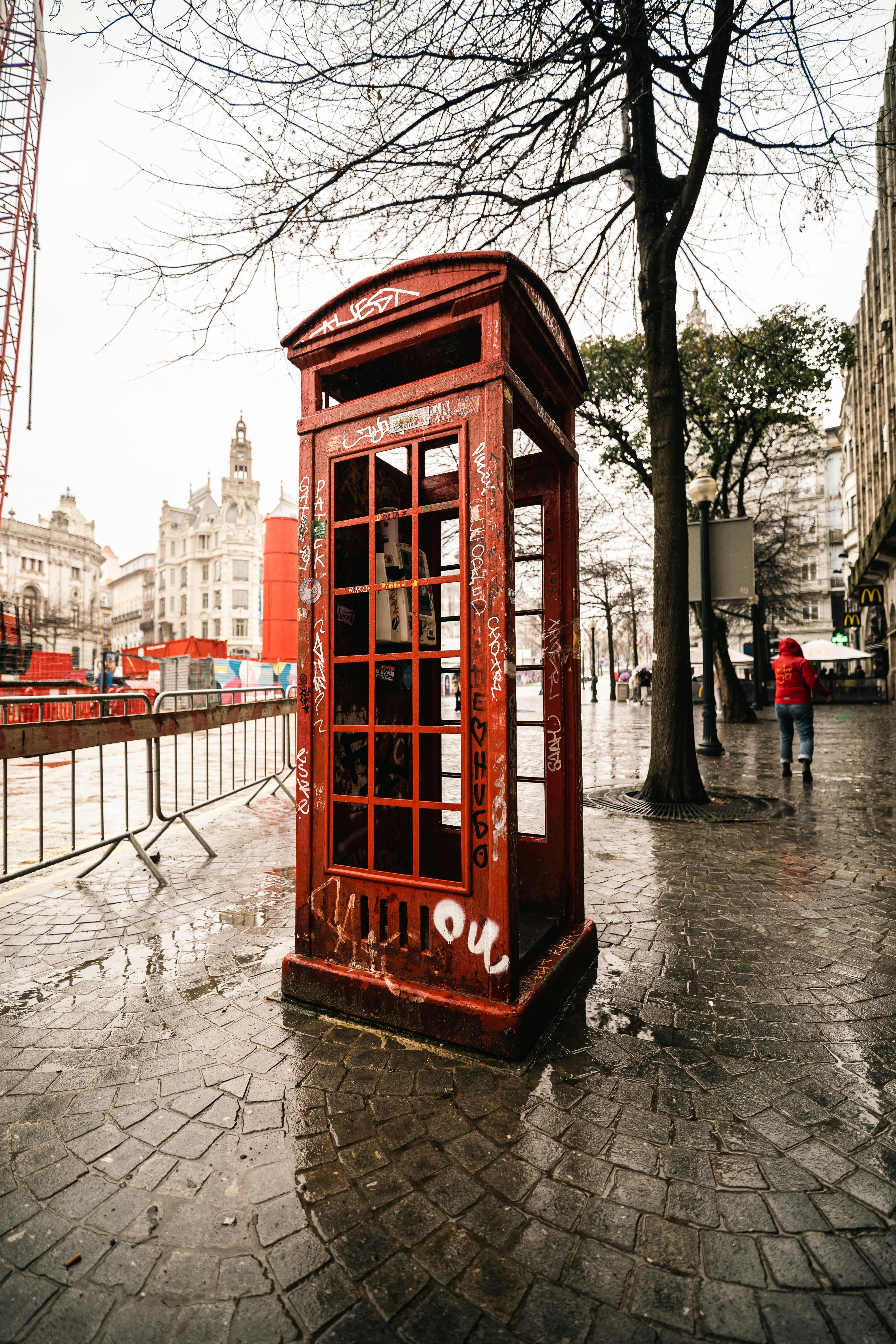 A Damaged Red Telephone Booth on a Sidewalk in Porto, Portugal · Free ...