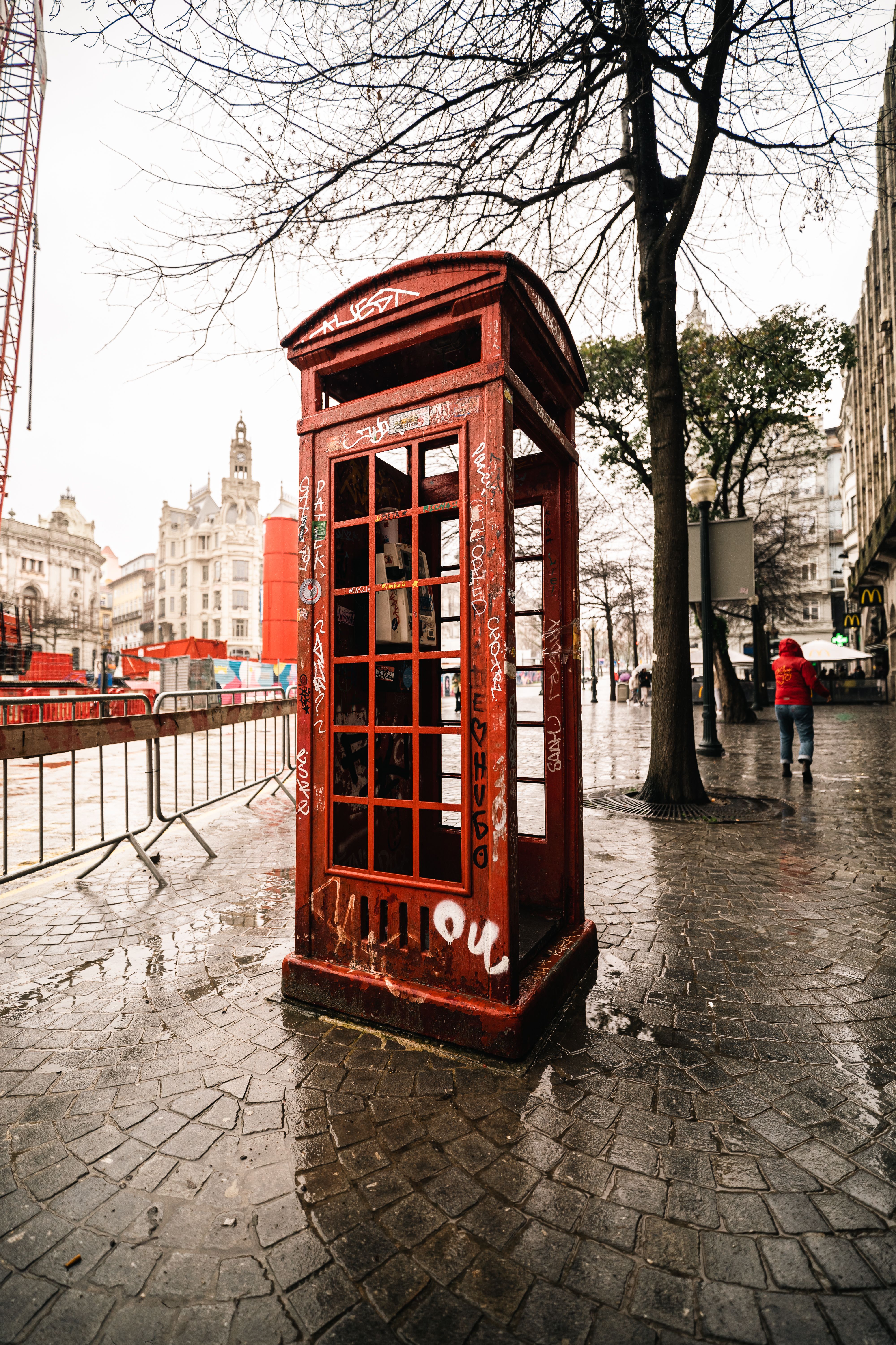 A Damaged Red Telephone Booth on a Sidewalk in Porto, Portugal · Free ...