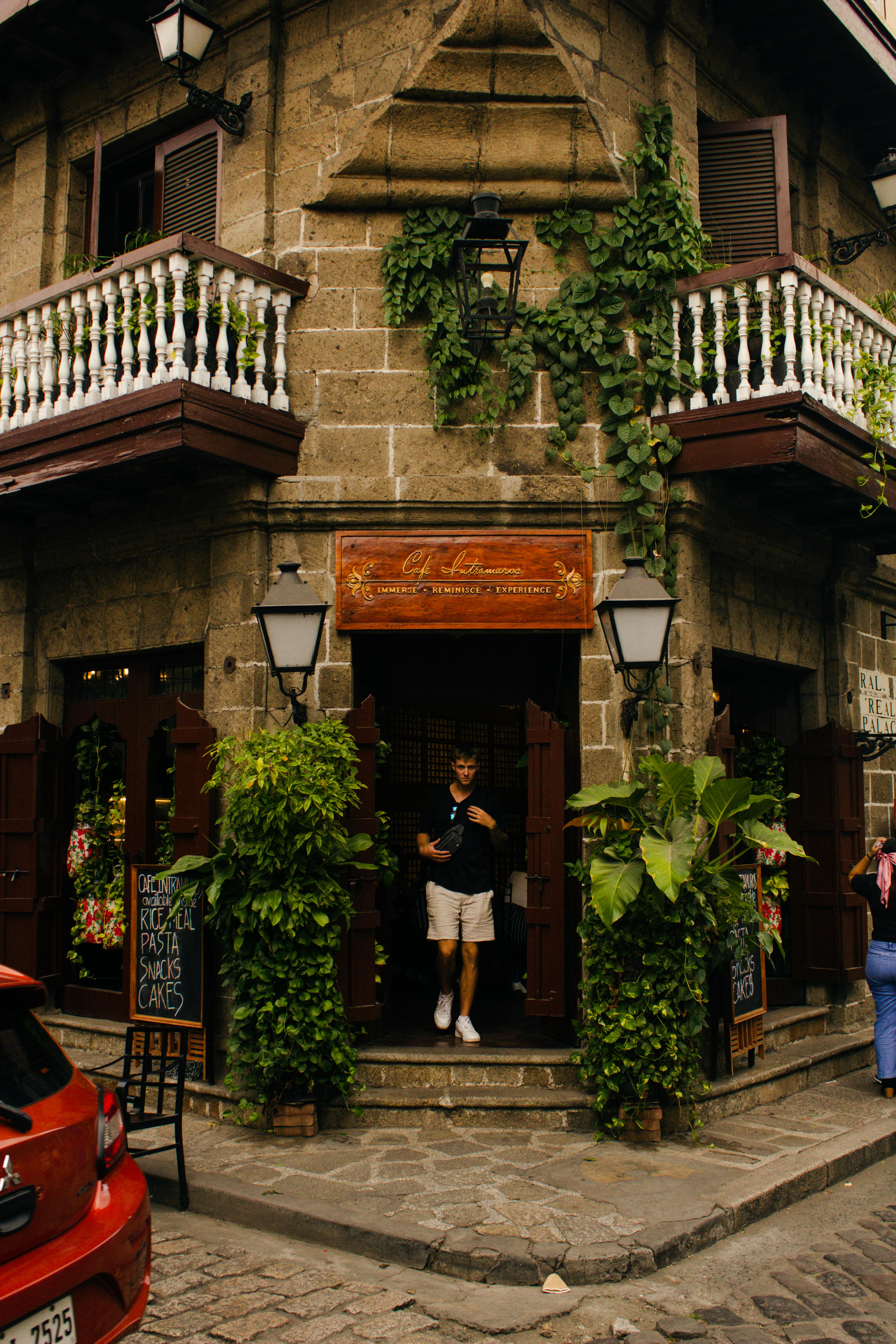 A Person Exiting a Building · Free Stock Photo