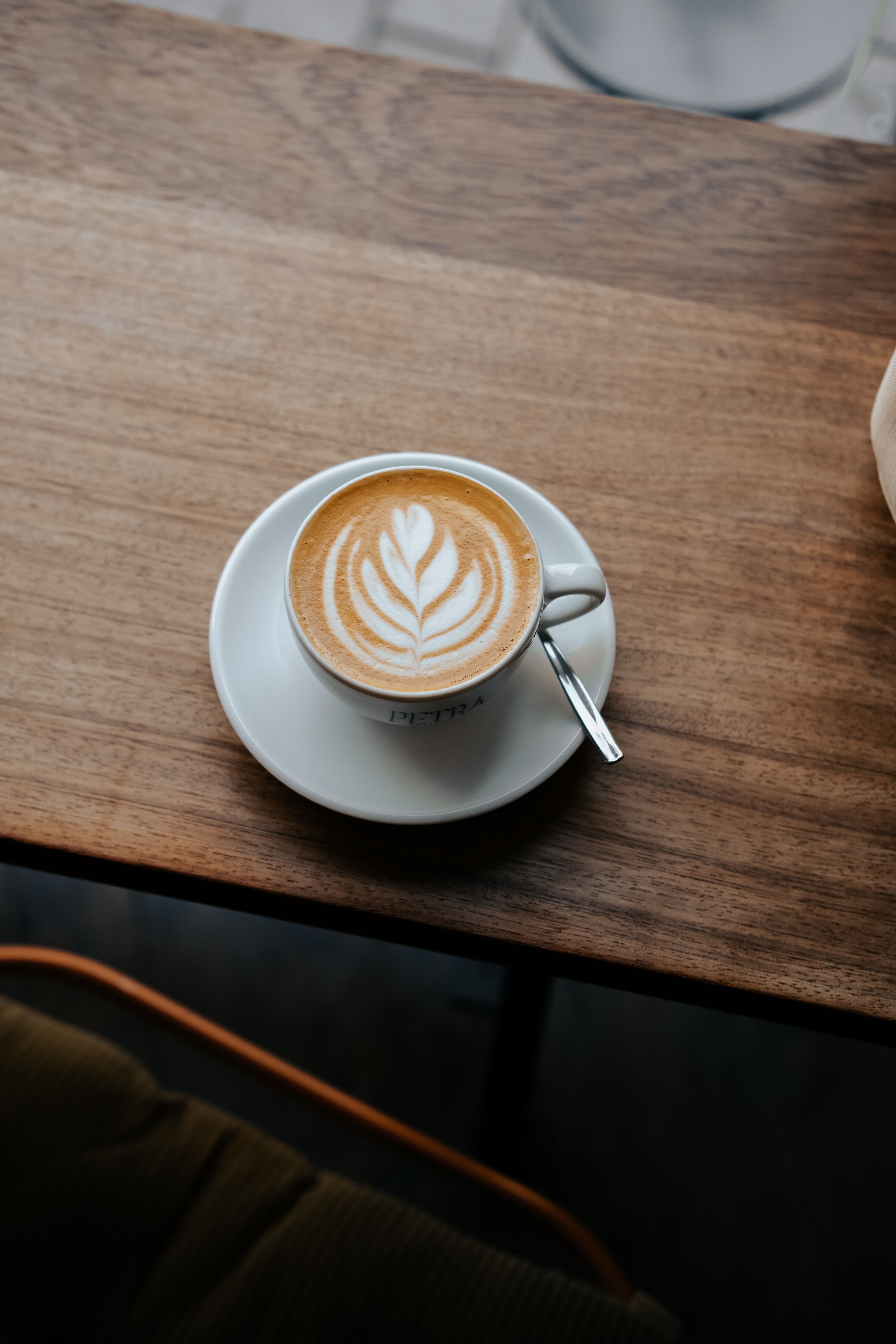 Cup Of Coffee On A Wooden Table · Free Stock Photo