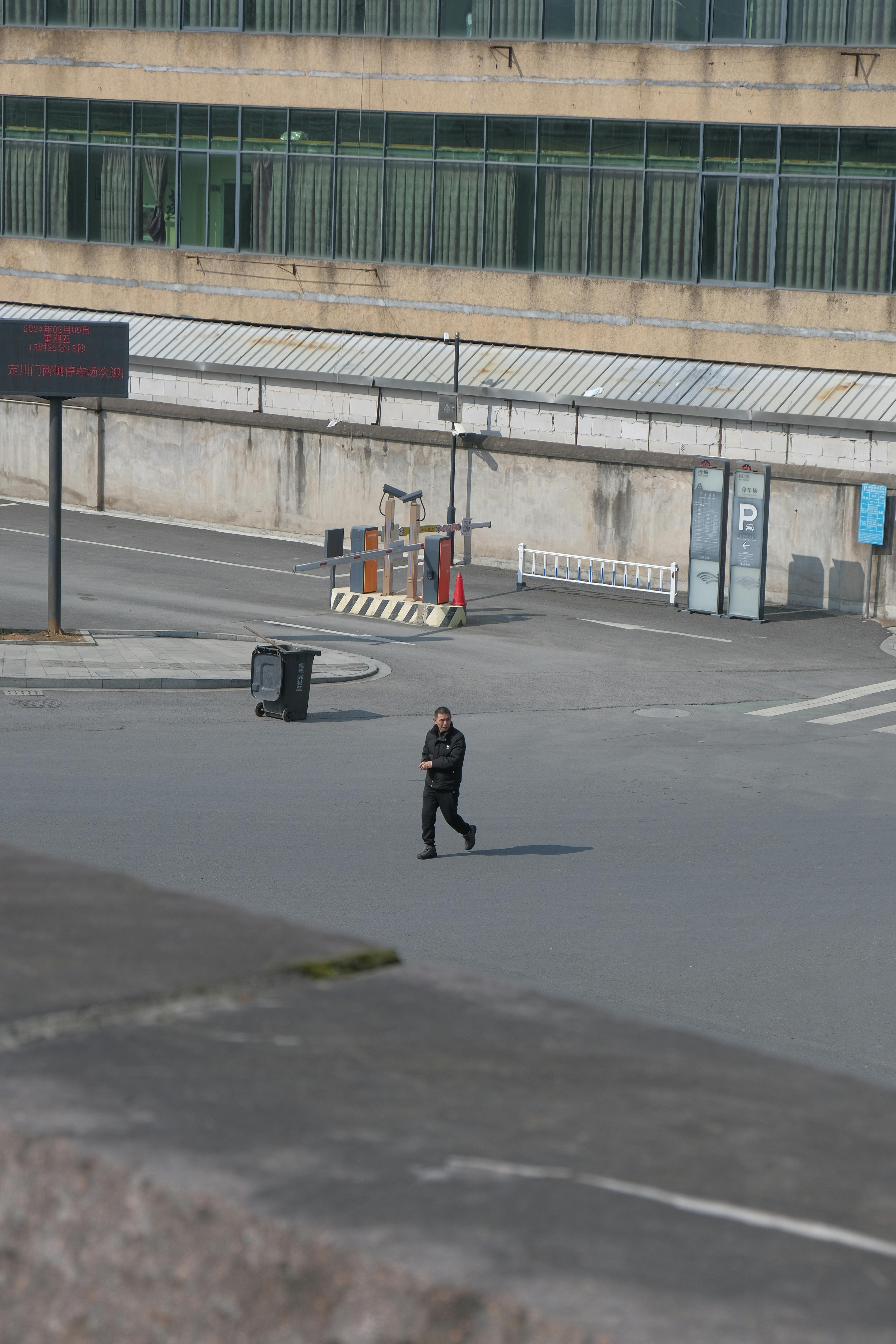 Security Guard on Parking Lot · Free Stock Photo