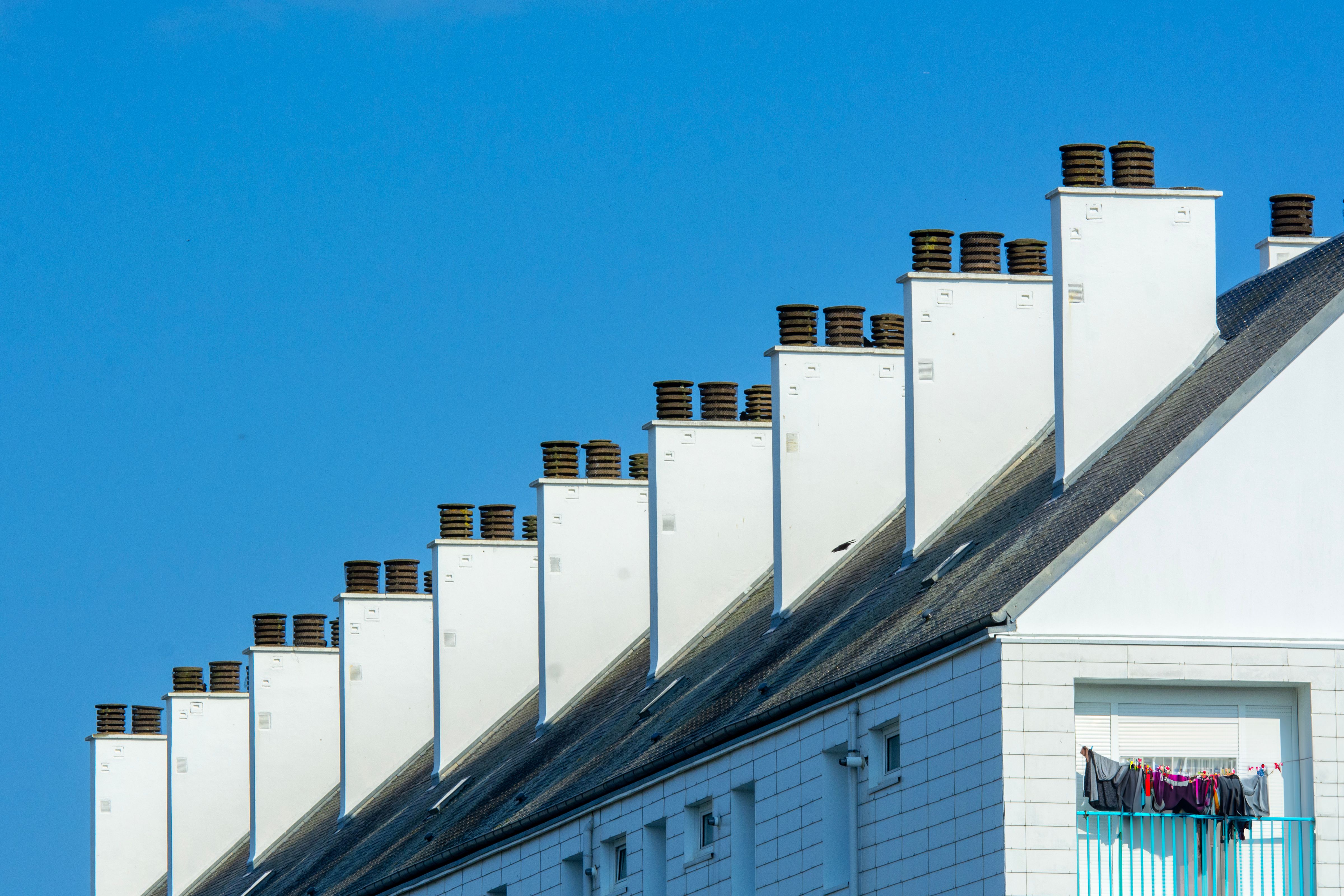 Rooftop with Chimneys of Residential Building · Free Stock Photo