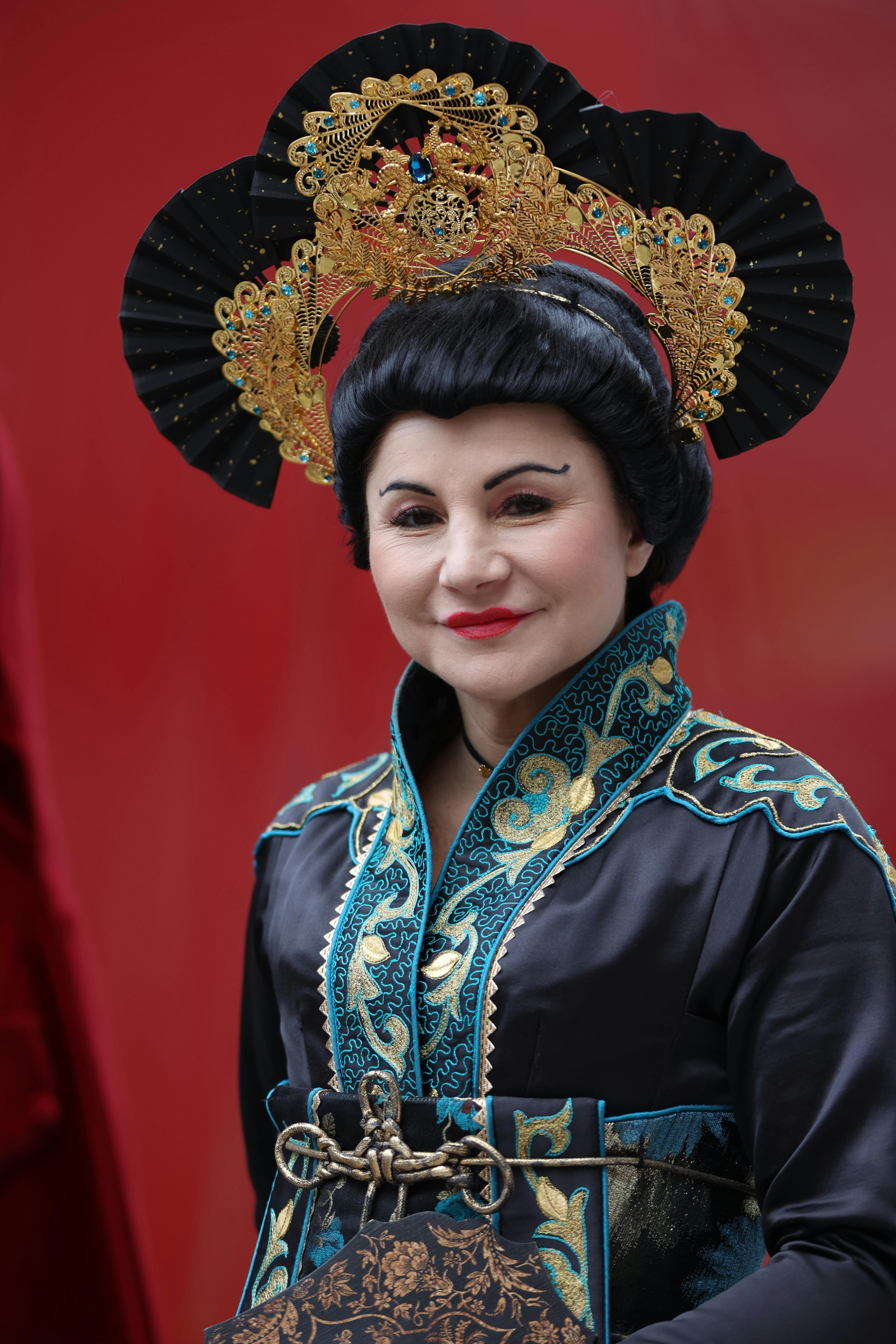 A woman in a traditional chinese dress and hat · Free Stock Photo