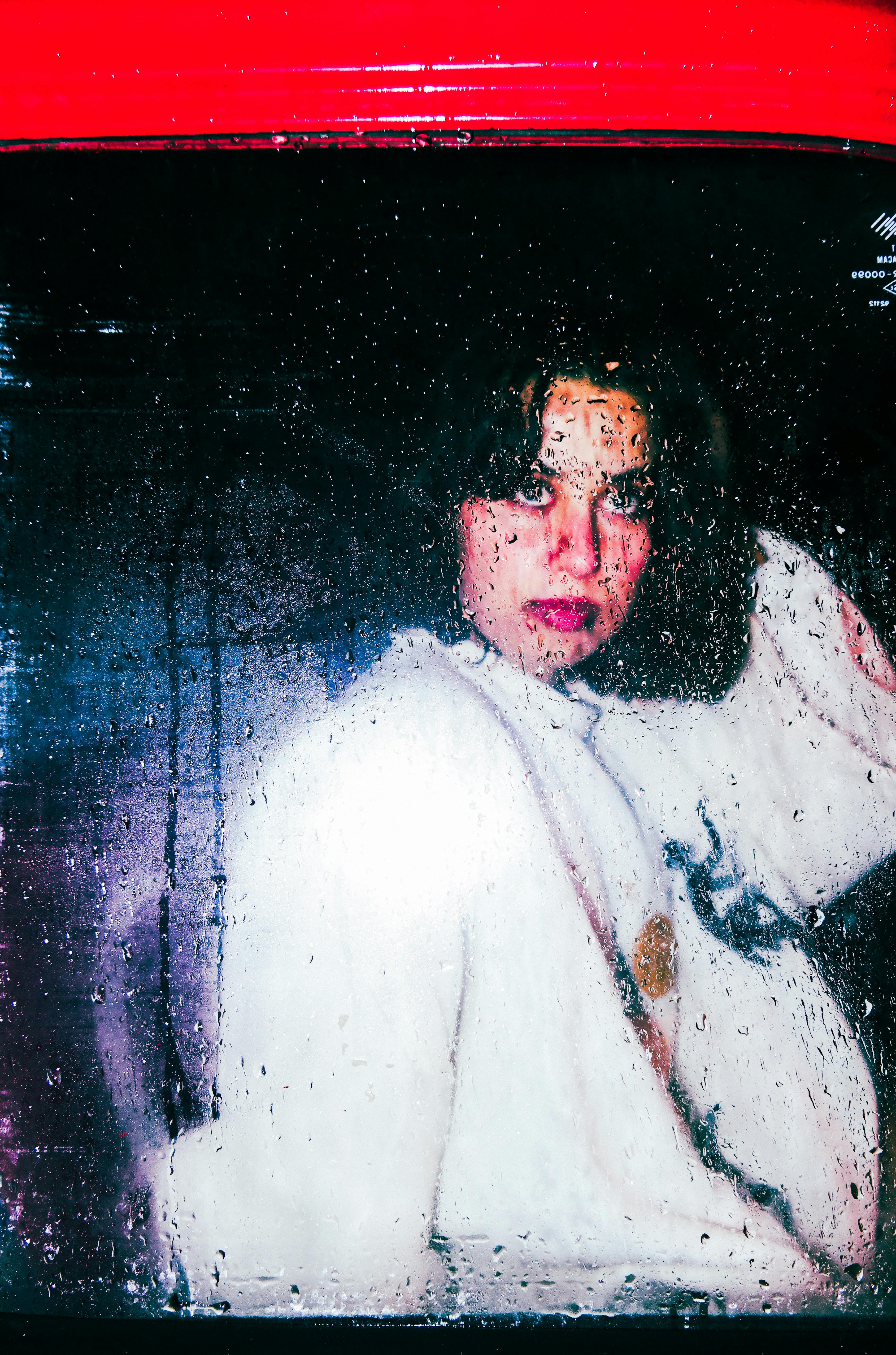 Portrait of Woman behind Window · Free Stock Photo