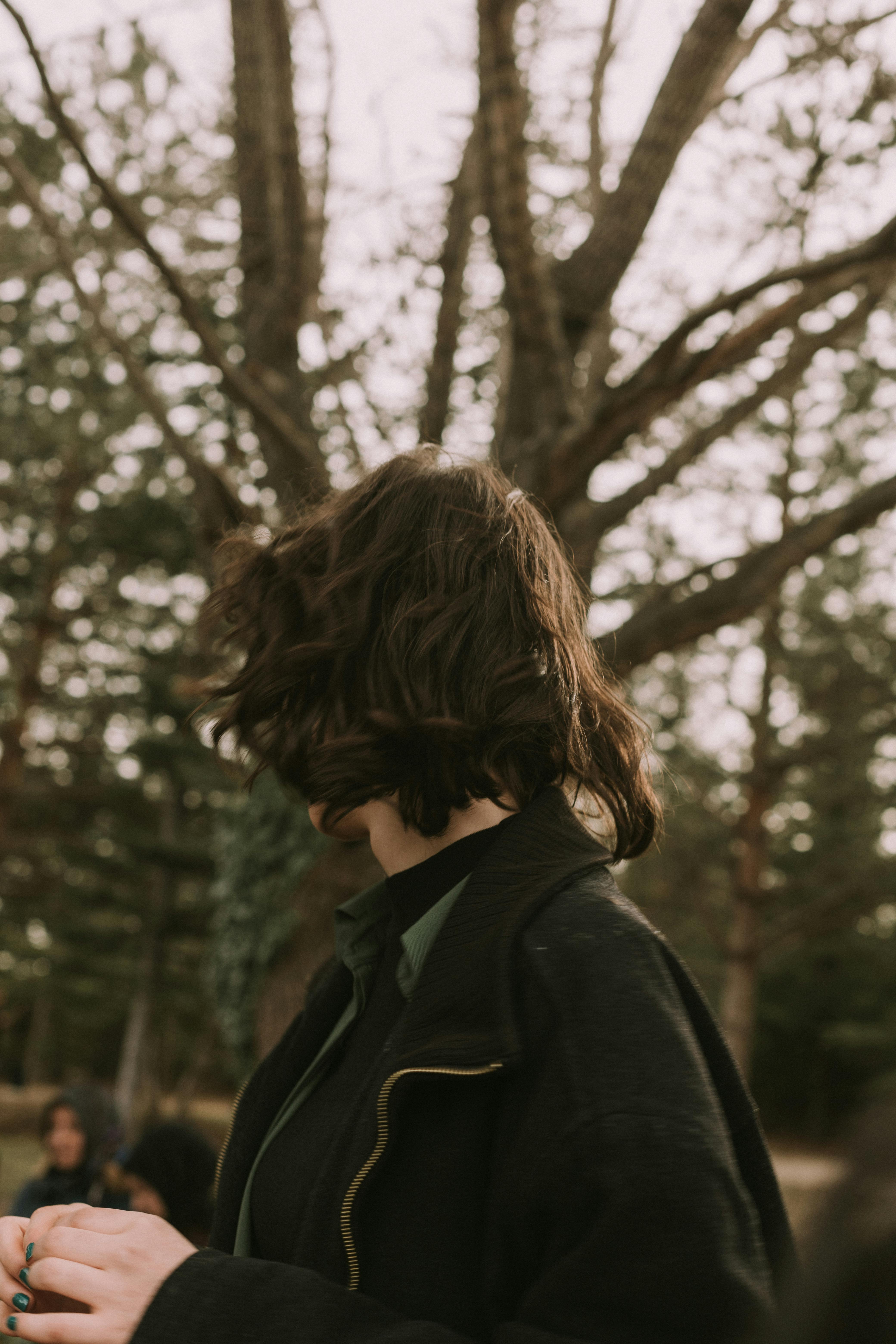 Woman Looking over Her Shoulder in the Park · Free Stock Photo