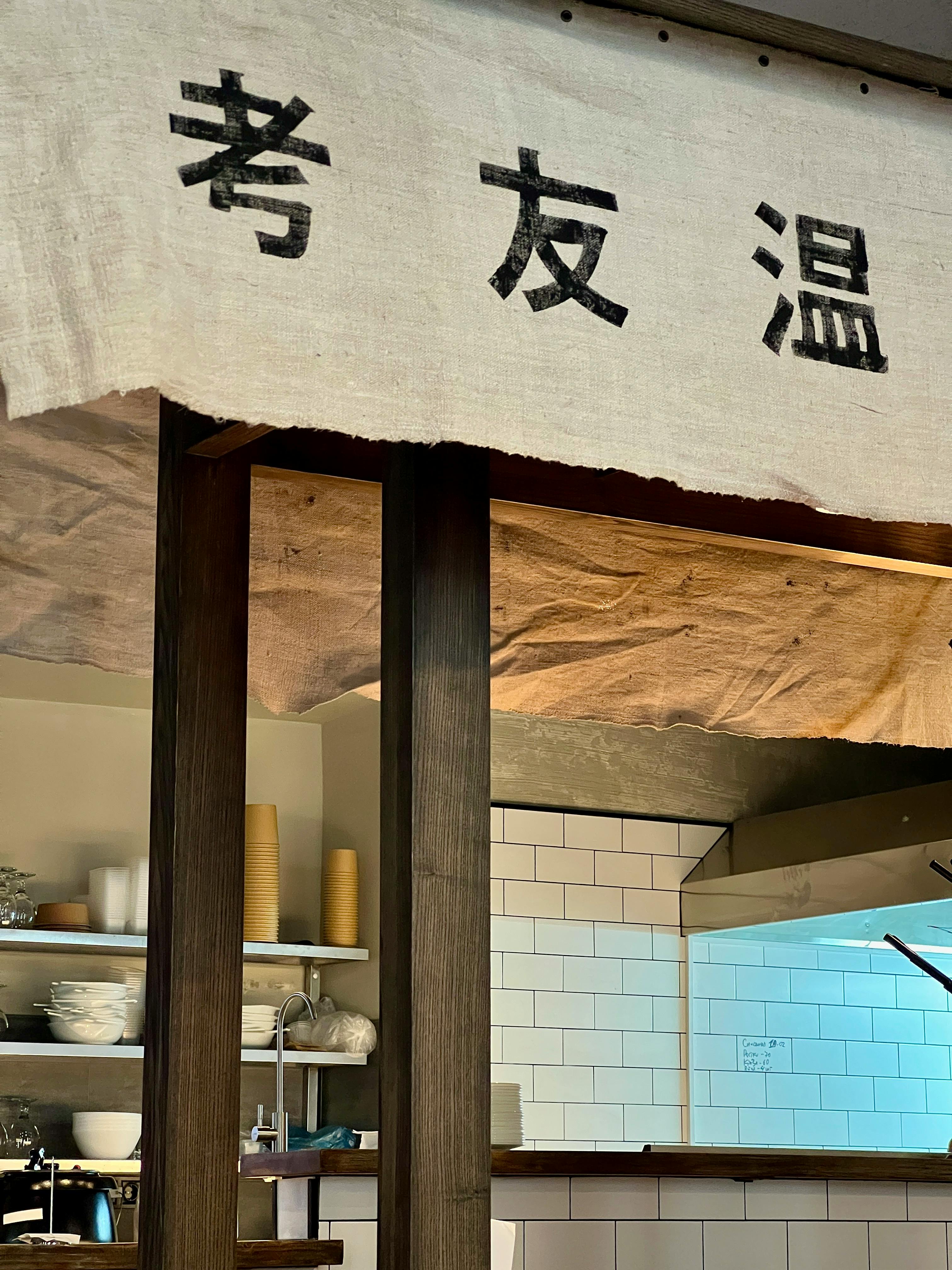 Text on Fabric over Counter in Restaurant · Free Stock Photo