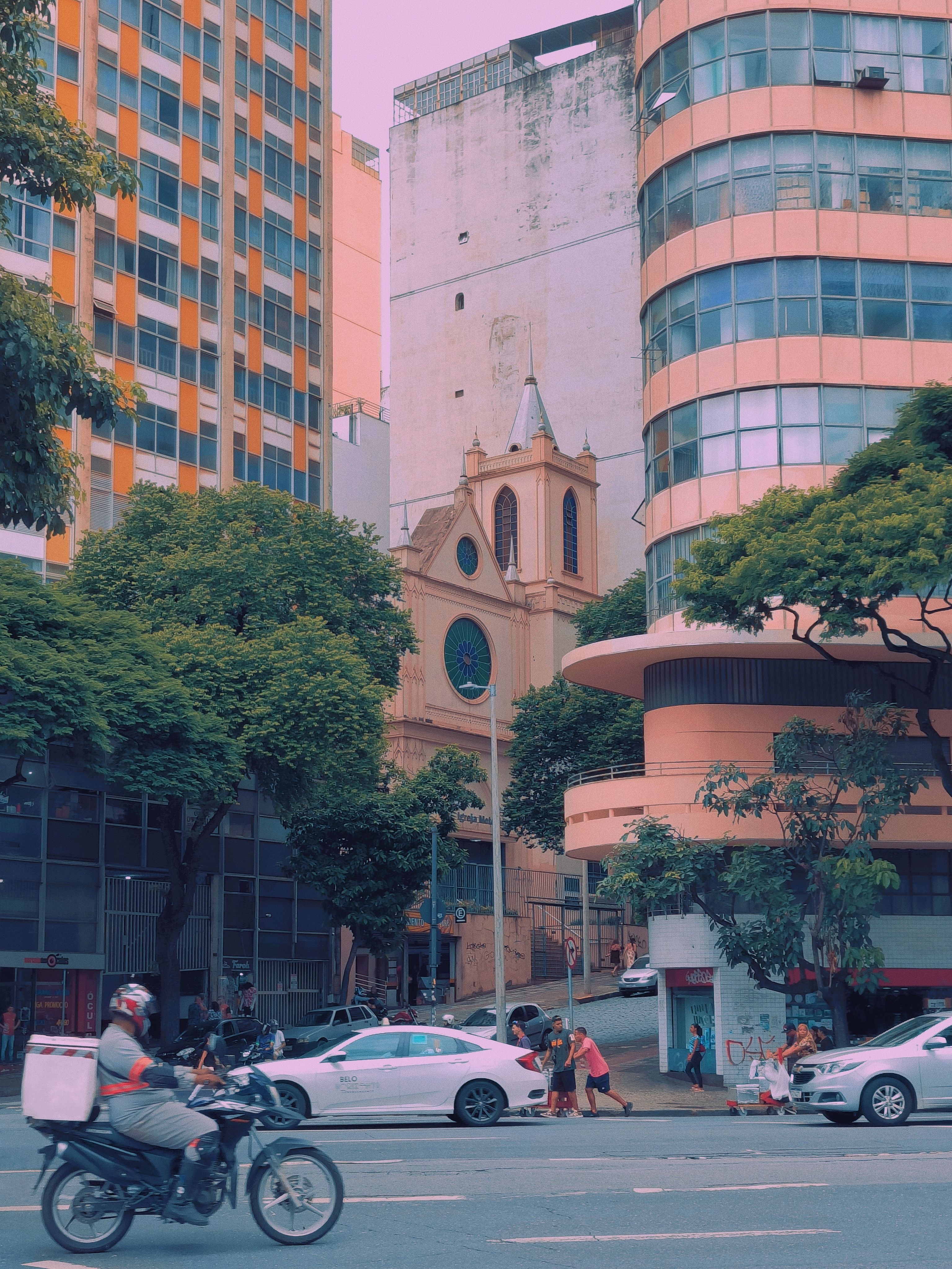 Church between Buildings in City · Free Stock Photo