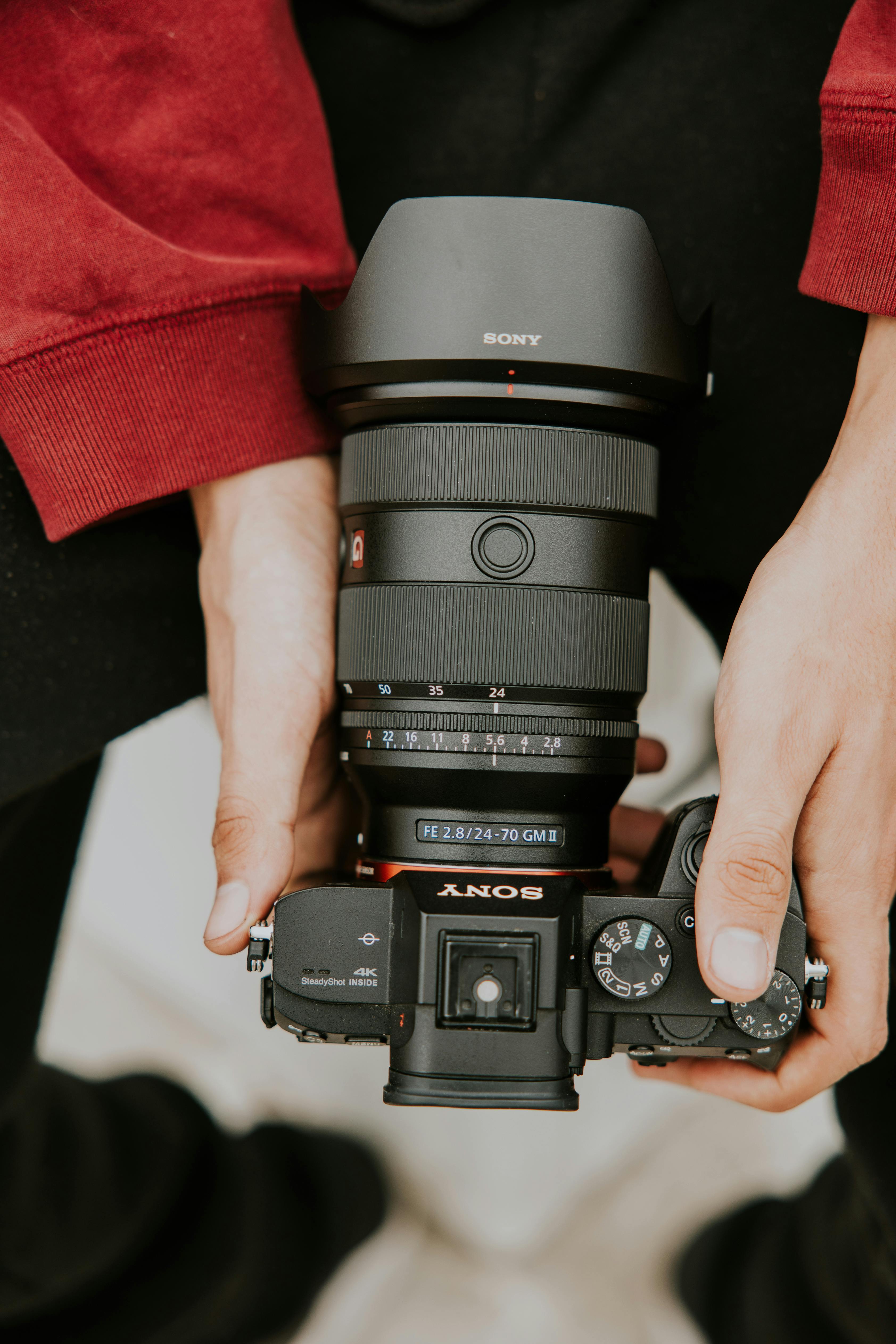 Person Holding Black Dslr Camera · Free Stock Photo