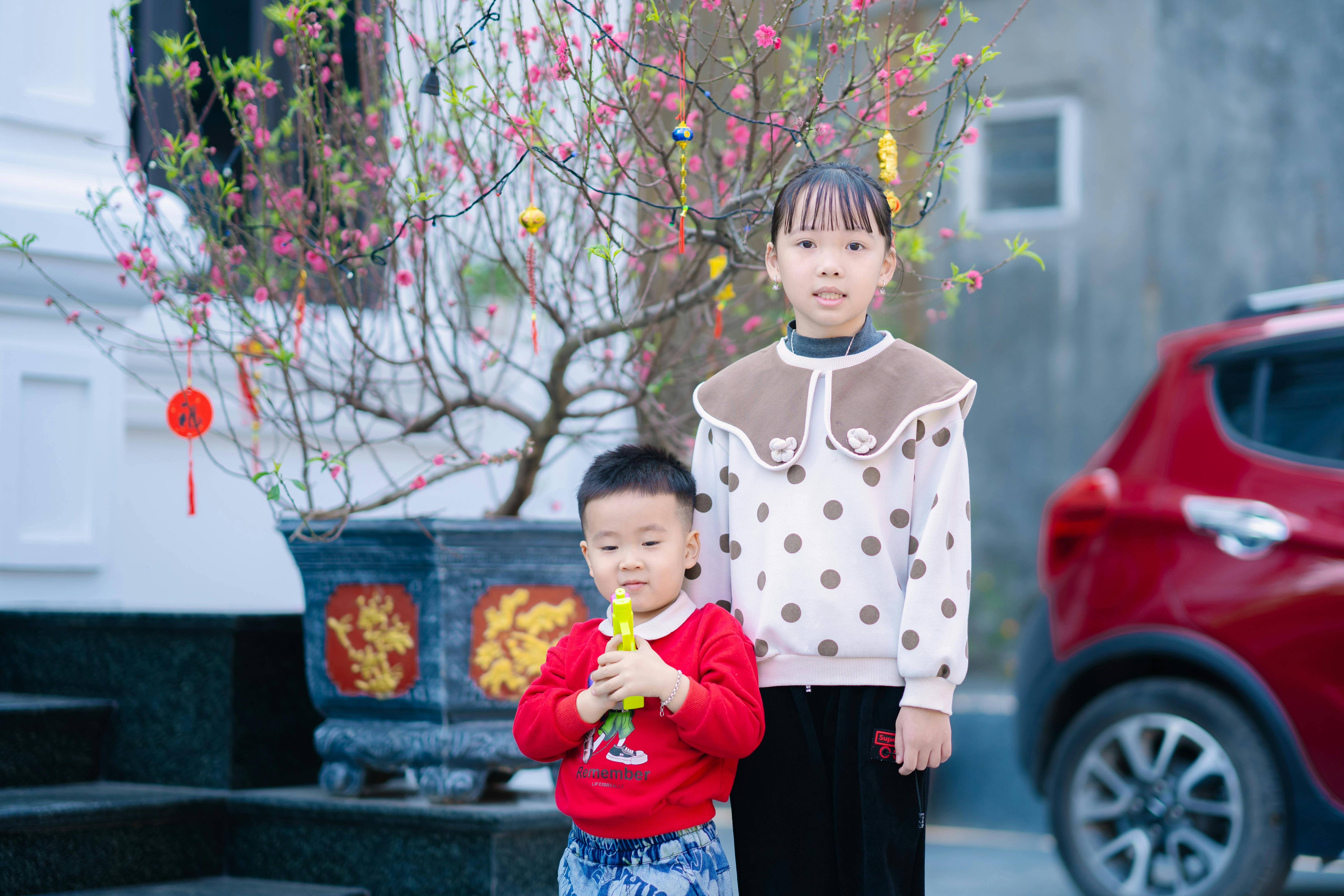 Two Kids Posing on the Street · Free Stock Photo
