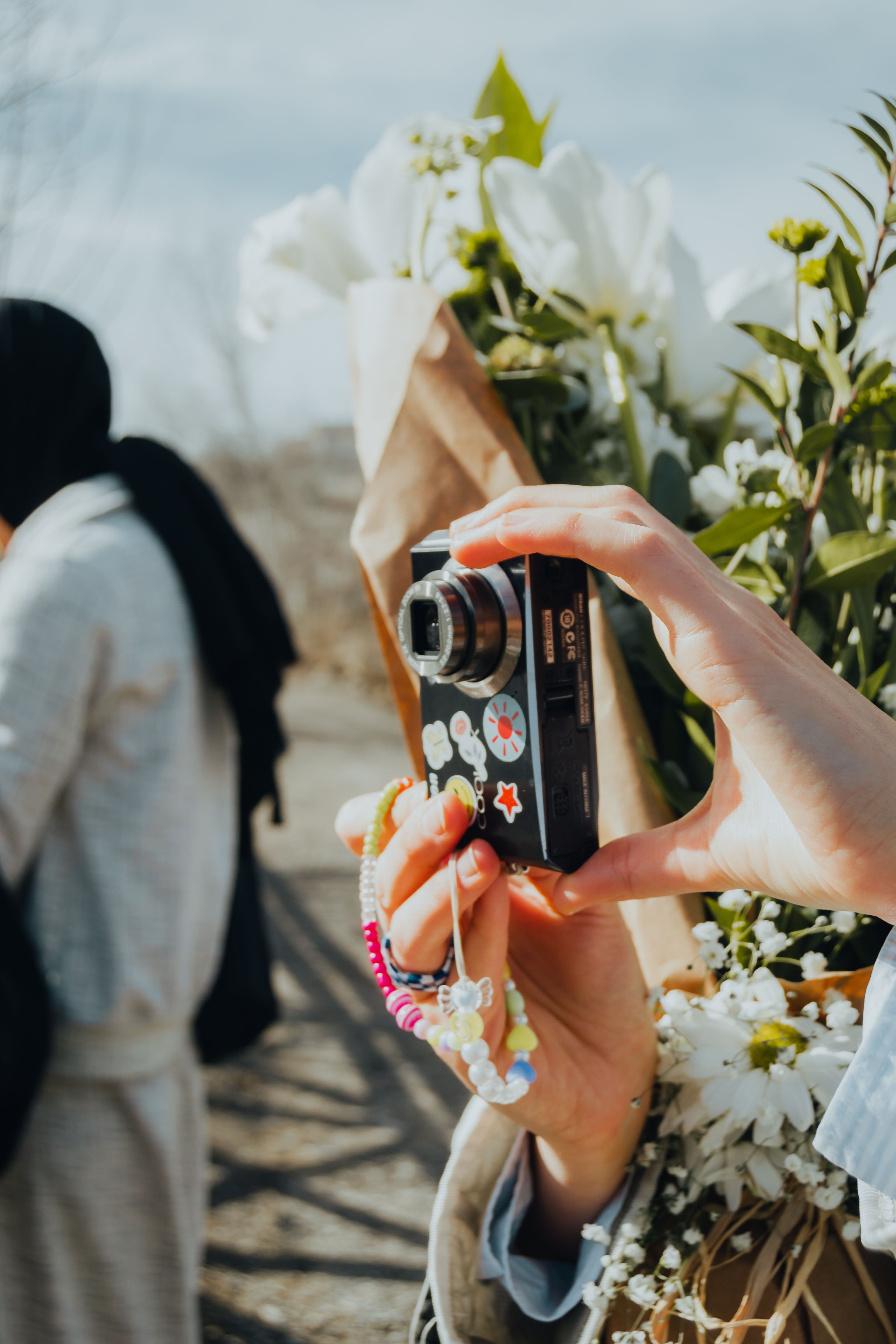Woman Hands Holding Camera with Stickers and Taking Pictures · Free ...