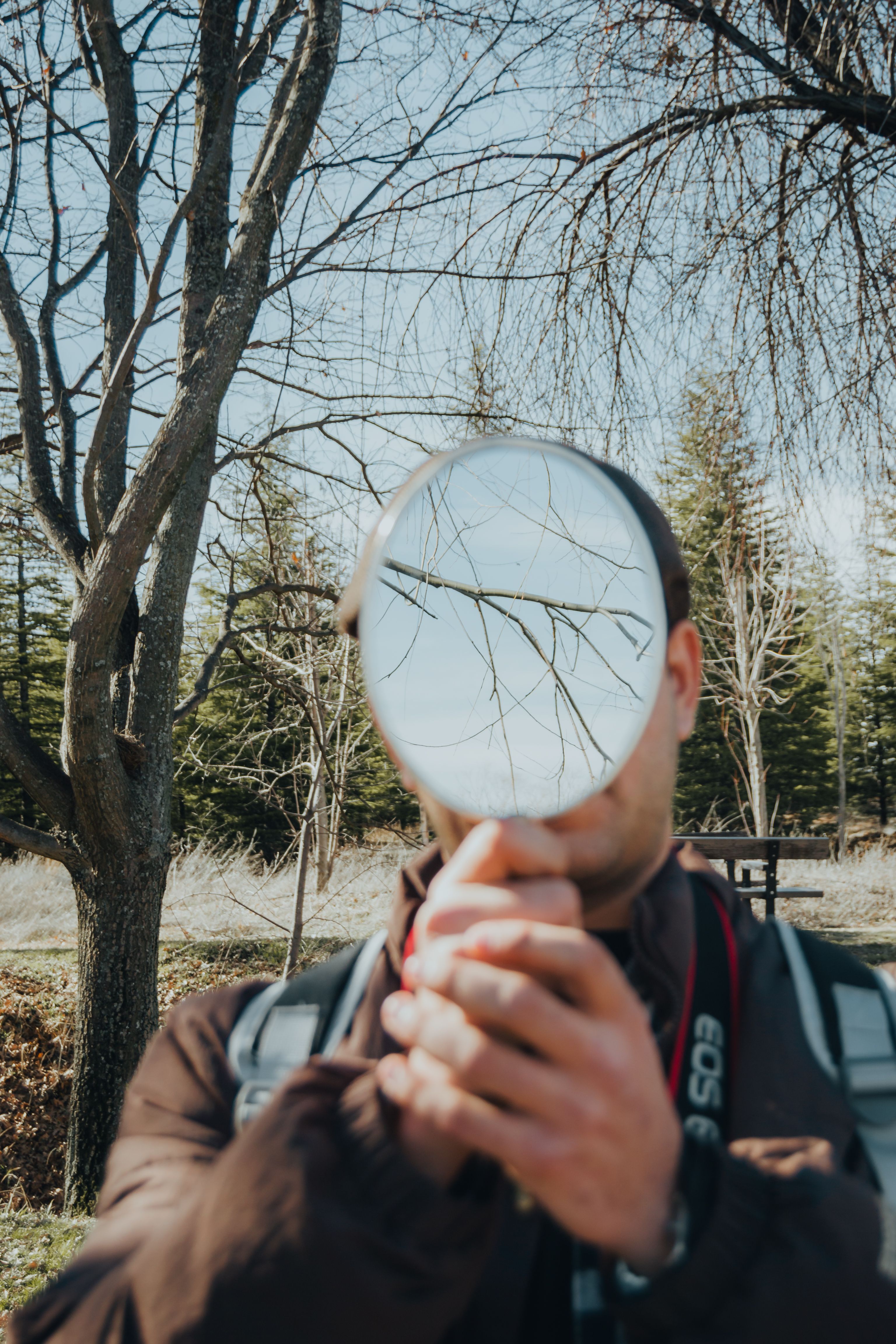 Man Covering Face with Mirror · Free Stock Photo