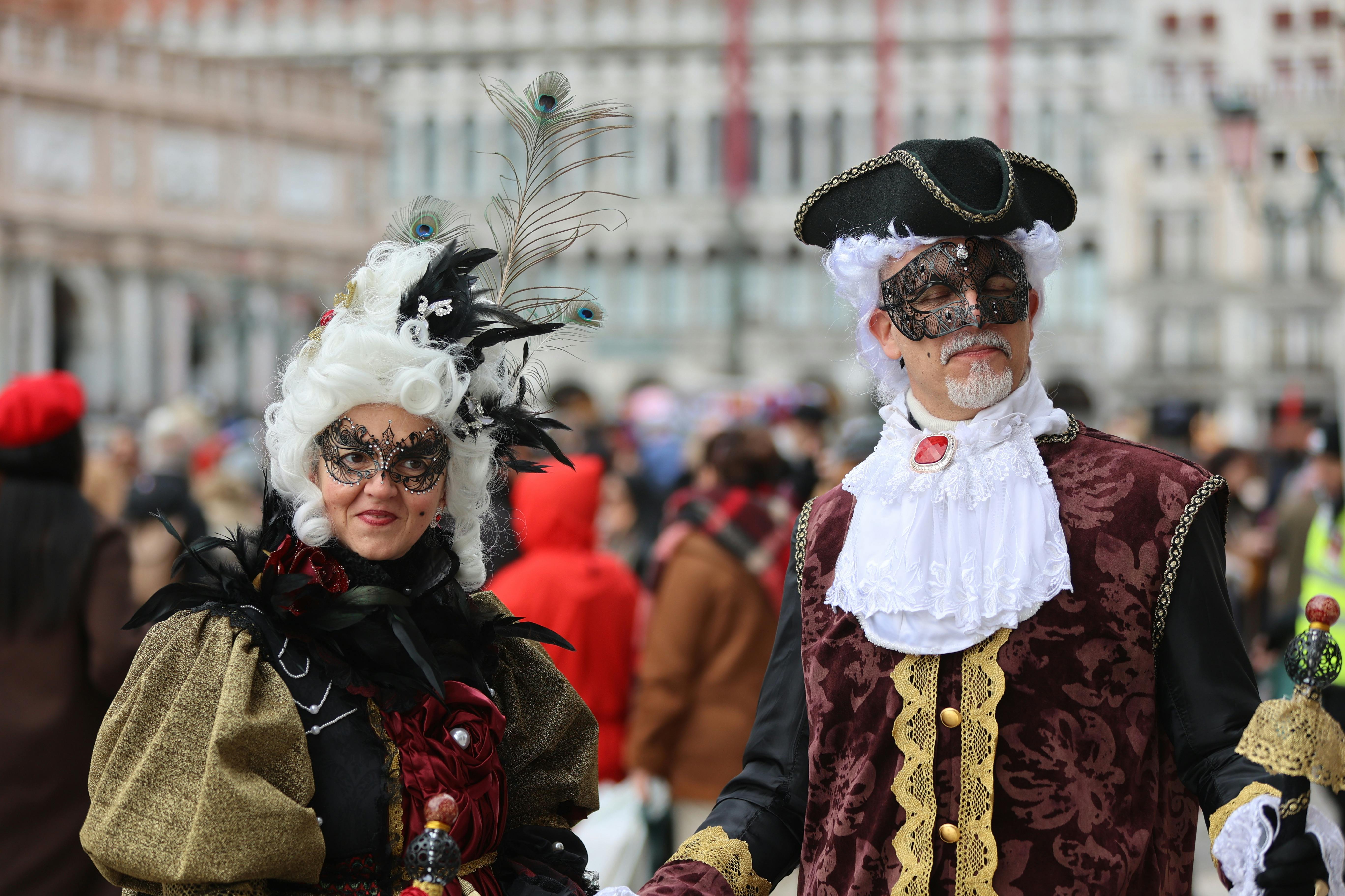 Man and a Woman Wearing Masquerade Costumes · Free Stock Photo
