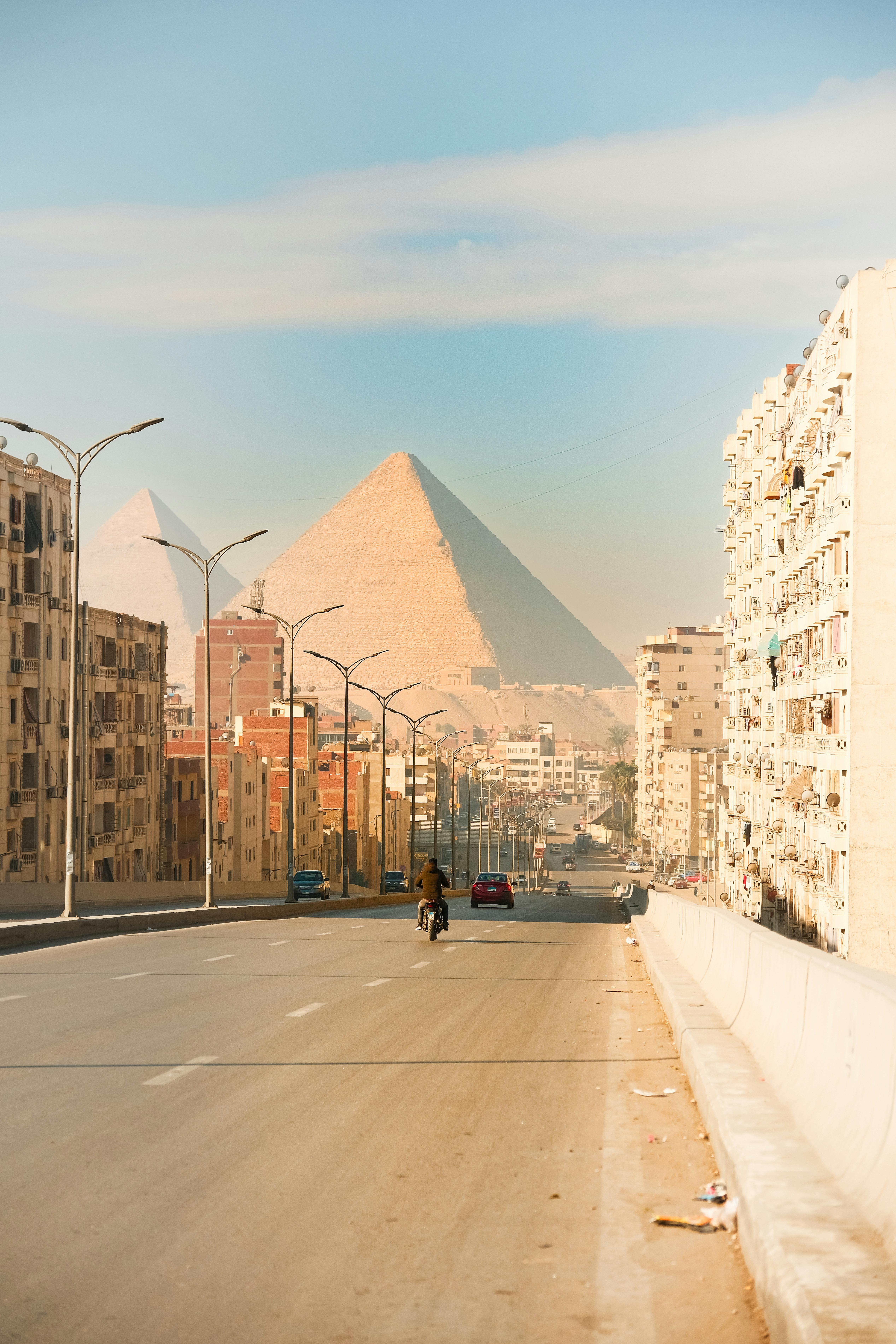 Road in Cairo with the Pyramids in the Background · Free Stock Photo
