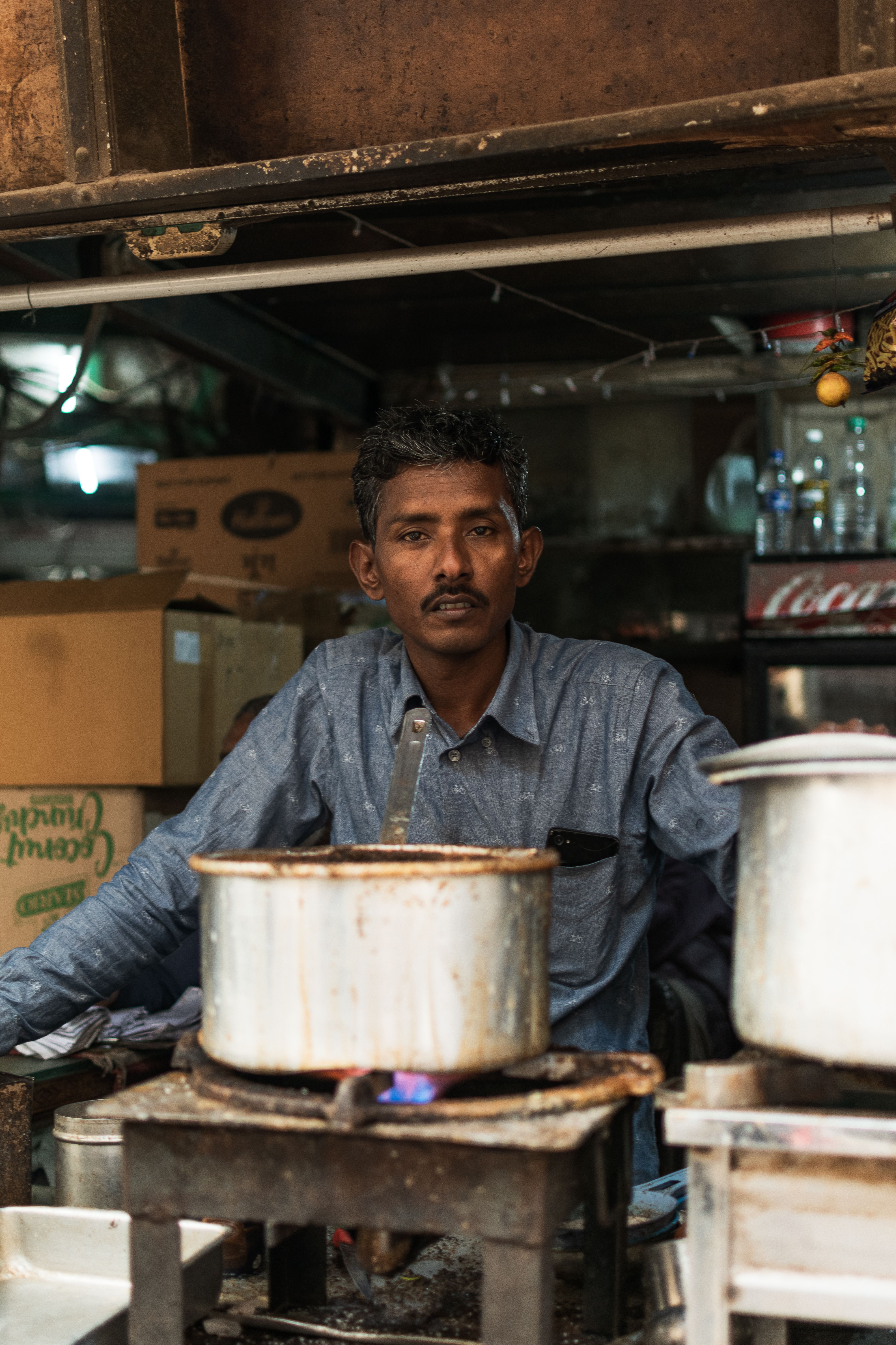 Man behind Pot on Stove · Free Stock Photo