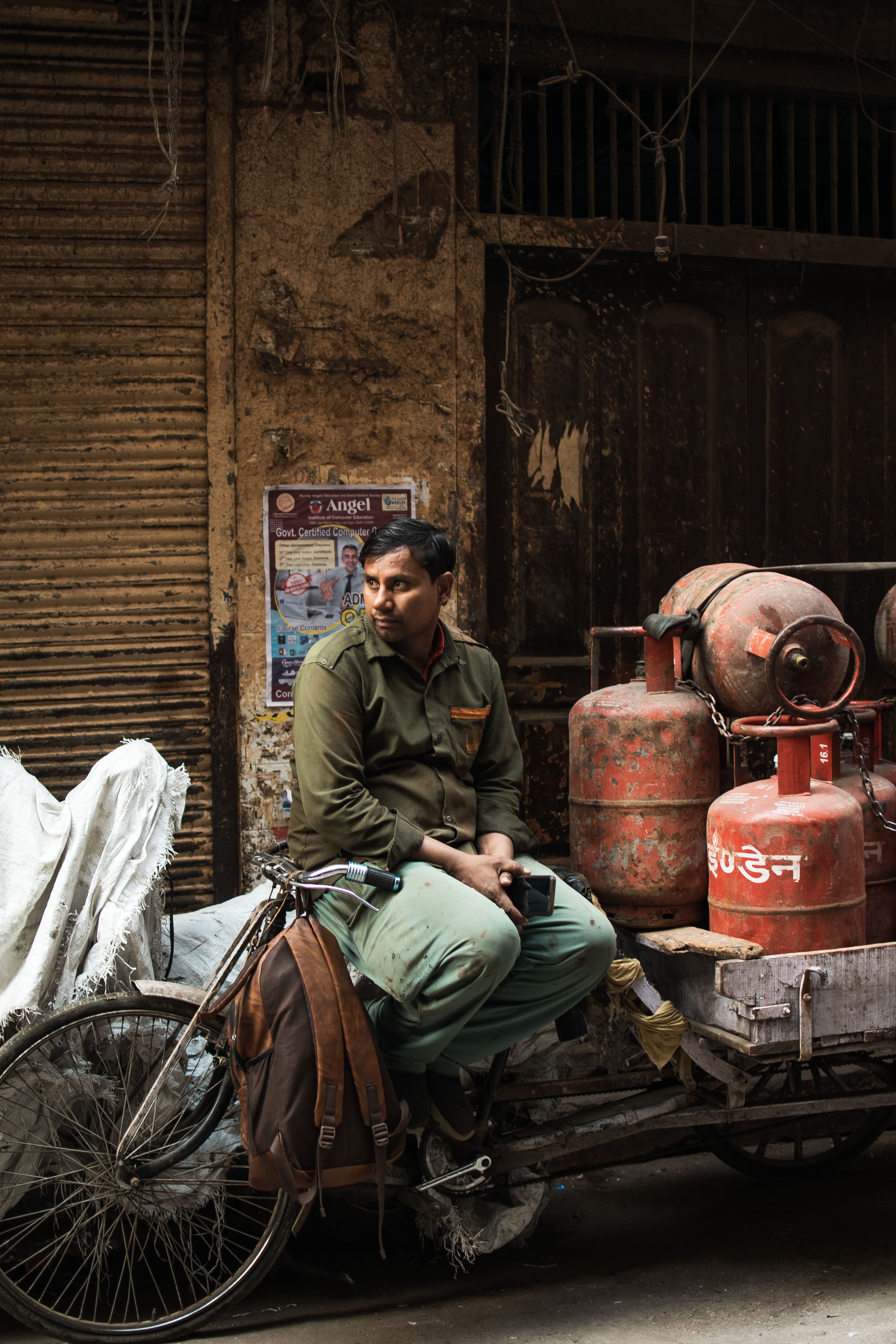Man Sitting on Bike with Trailer with Kegs · Free Stock Photo