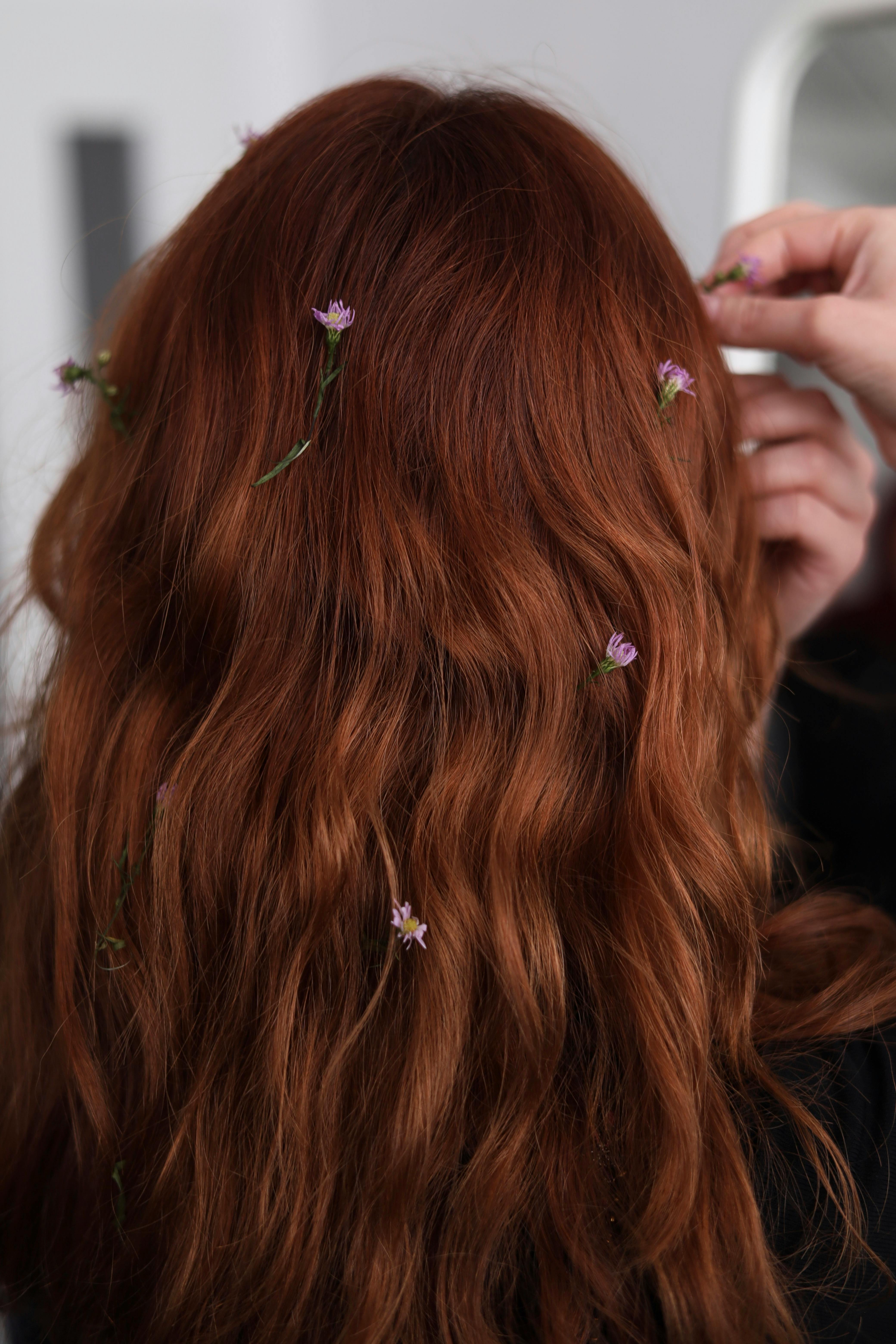 Small Flowers Petals in Redhead Woman Hair · Free Stock Photo