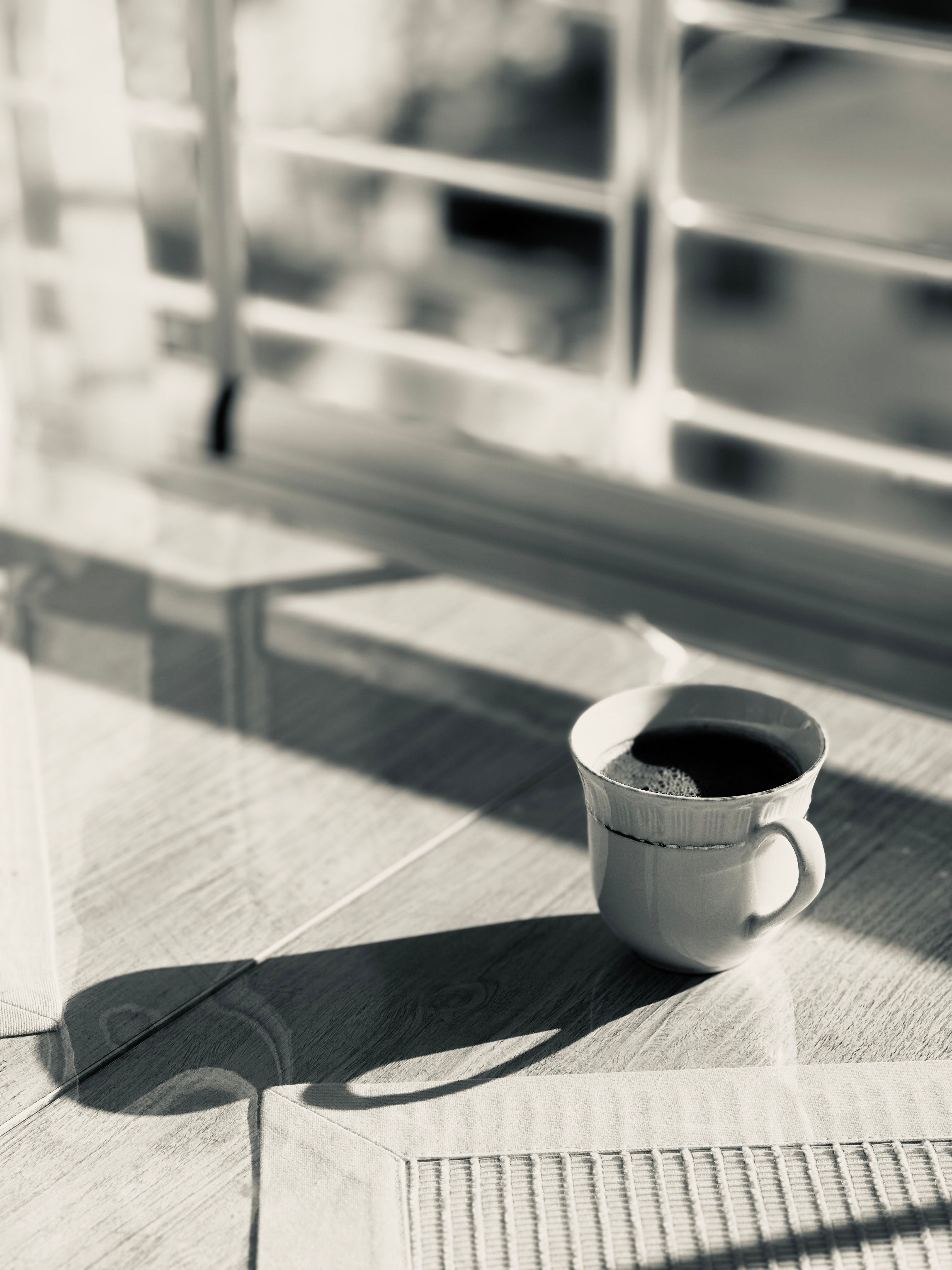 Cup of Coffee Casting Shadow · Free Stock Photo