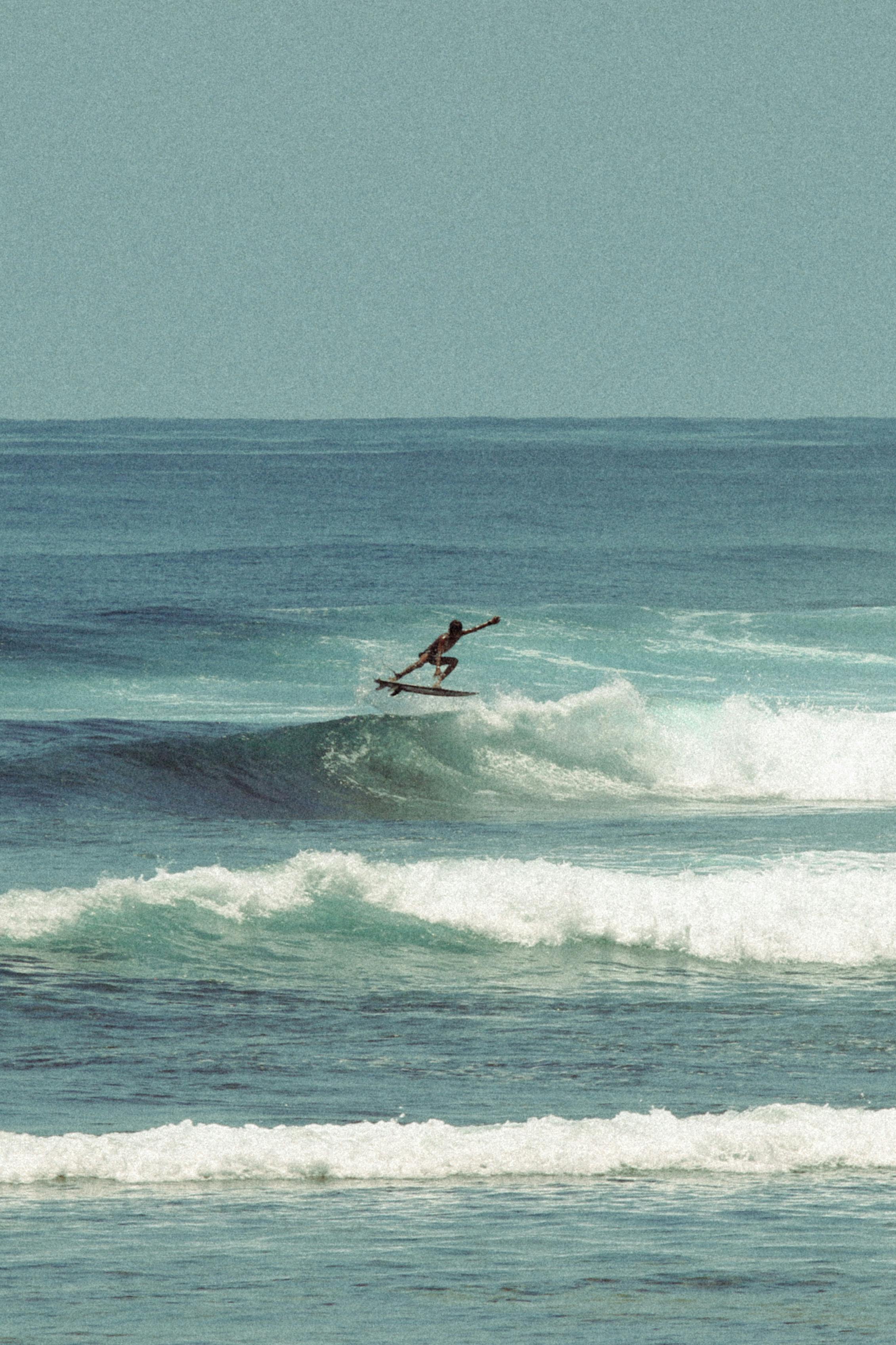 Surfer Jumping on Waves · Free Stock Photo
