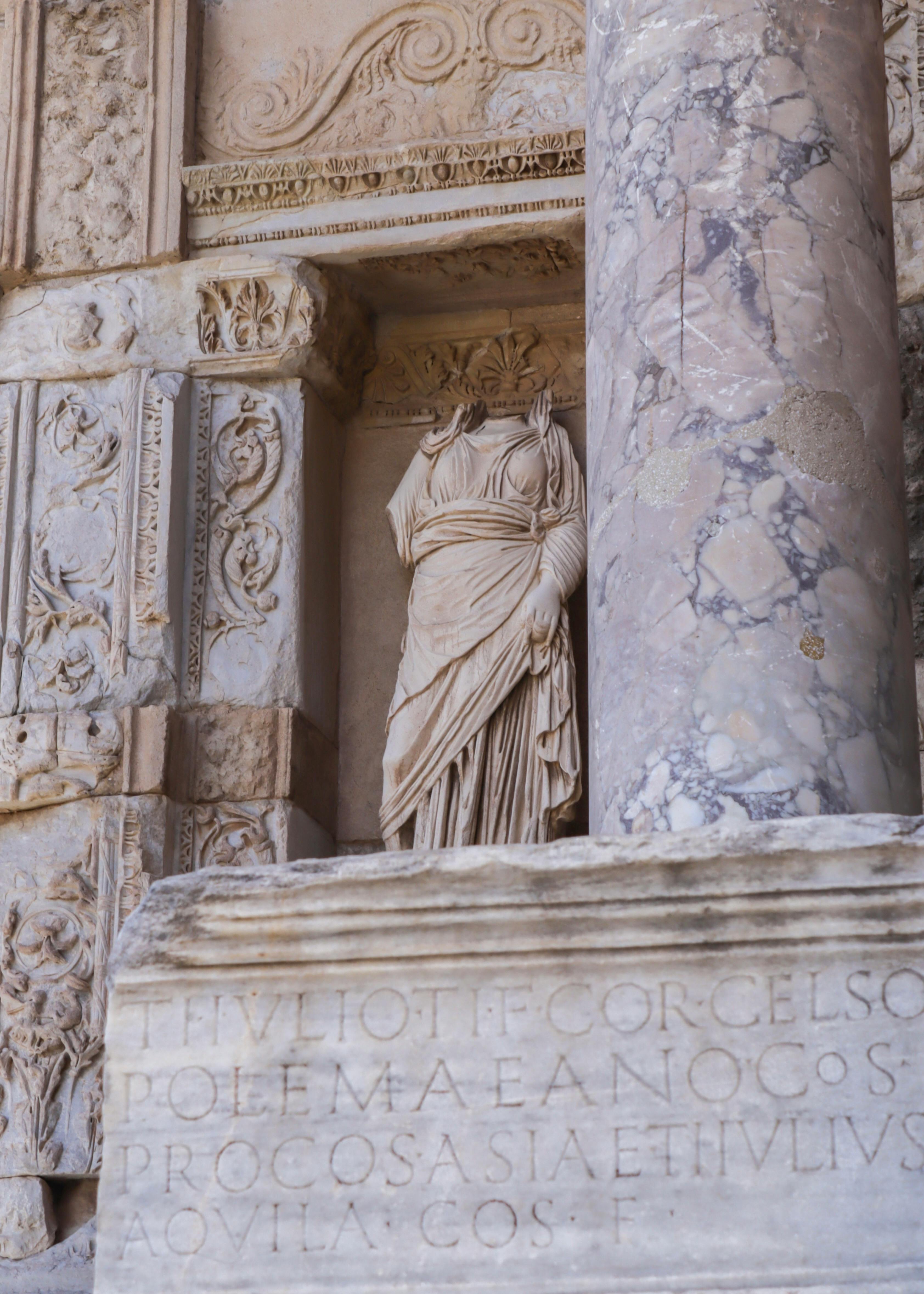 Sculpture and Column over Latin Inscription on Wall · Free Stock Photo