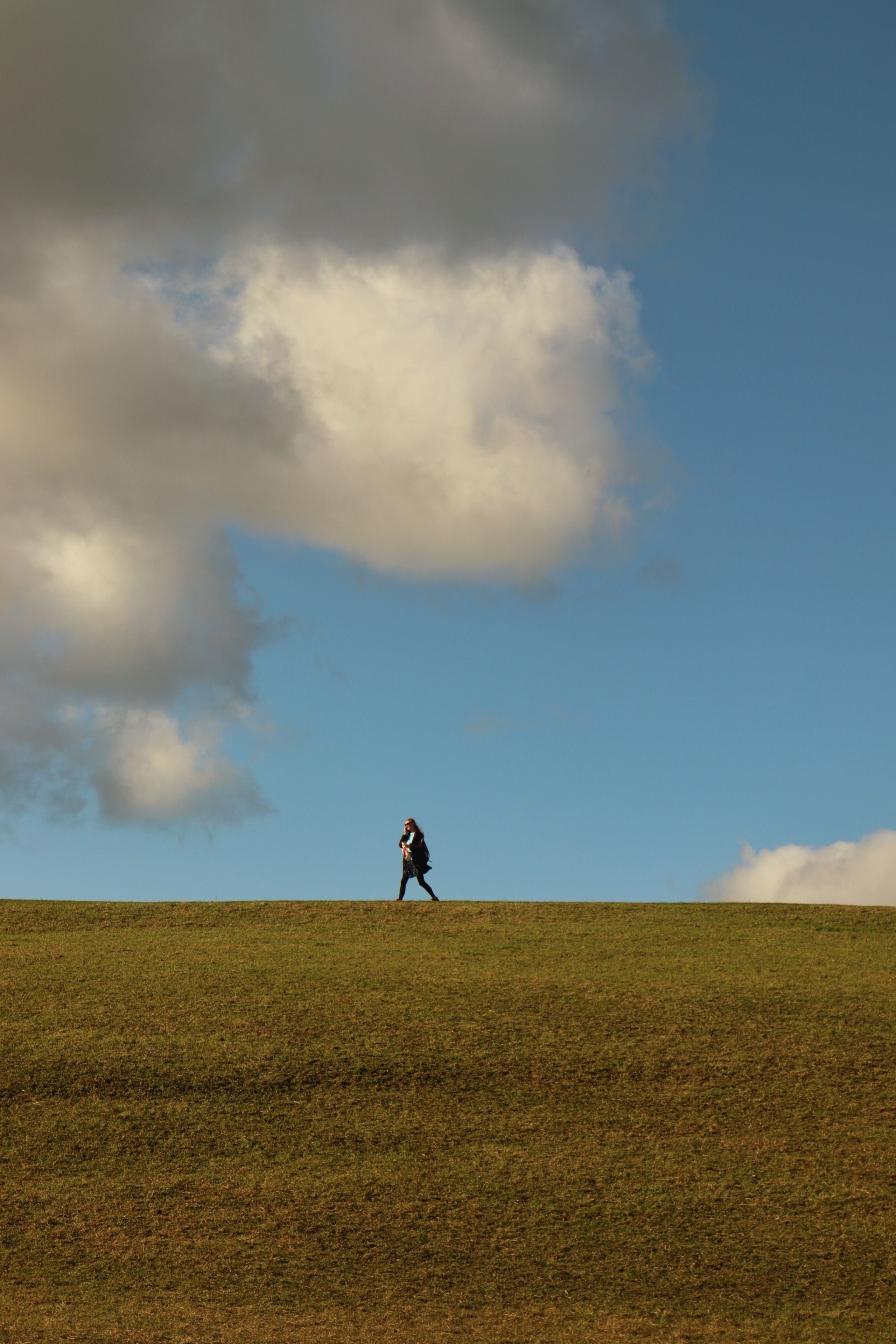 Person Walking on Rural Field · Free Stock Photo