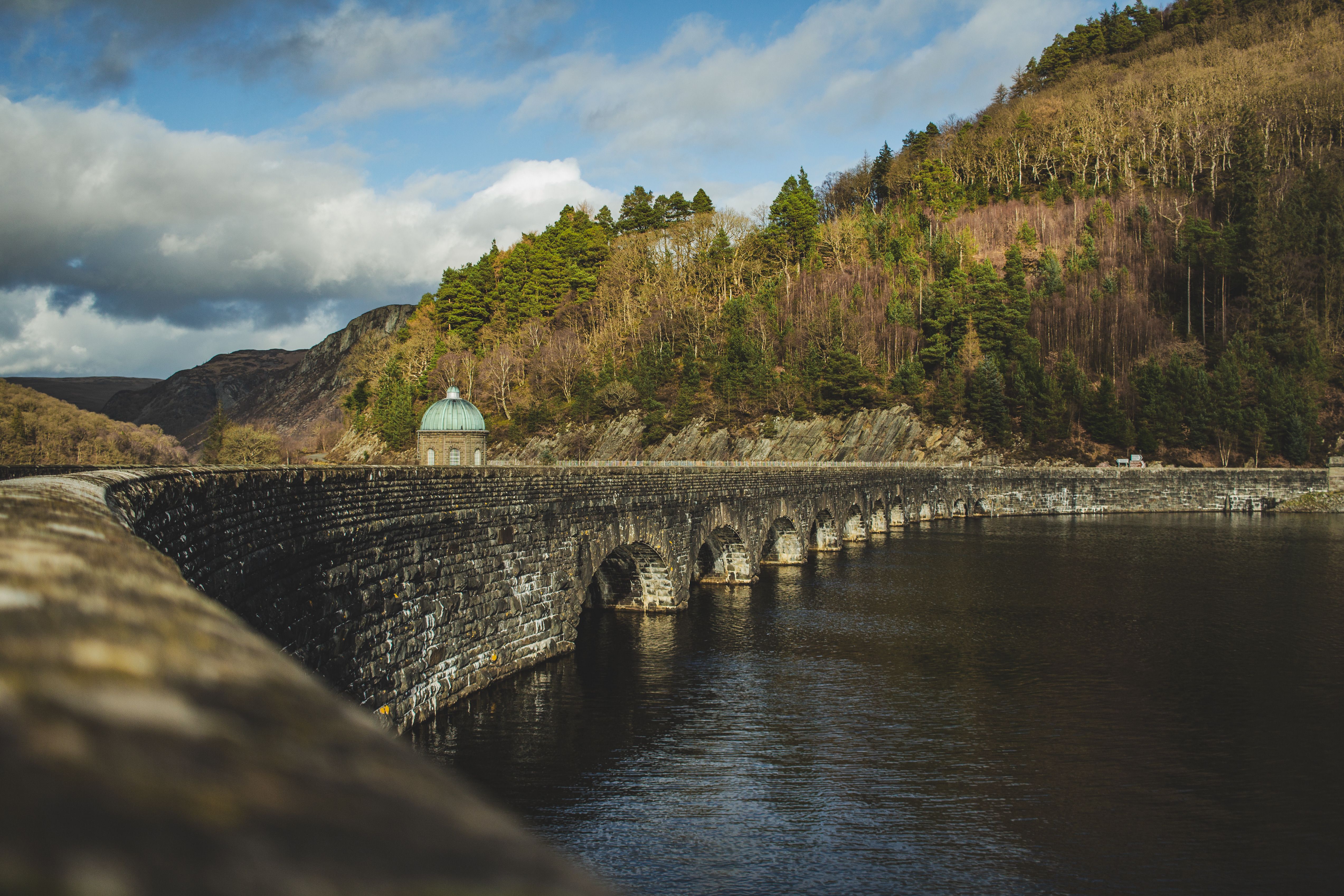 Old Stone Bridge over Reservoir Near Green Hill · Free Stock Photo