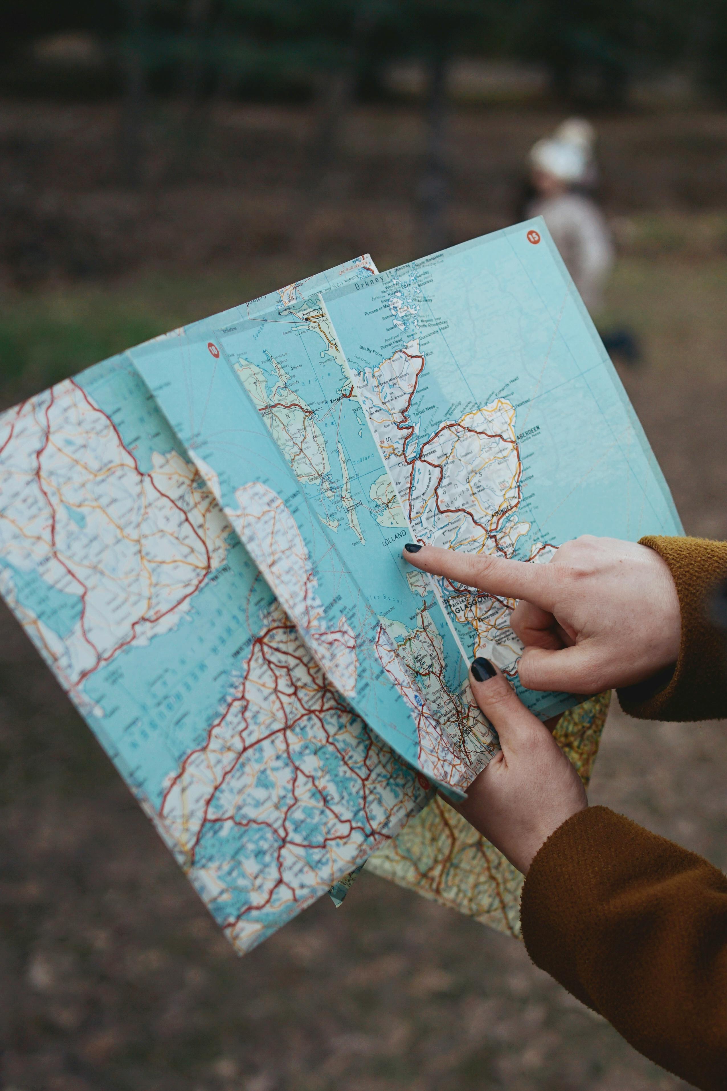 Woman Holding a Map · Free Stock Photo