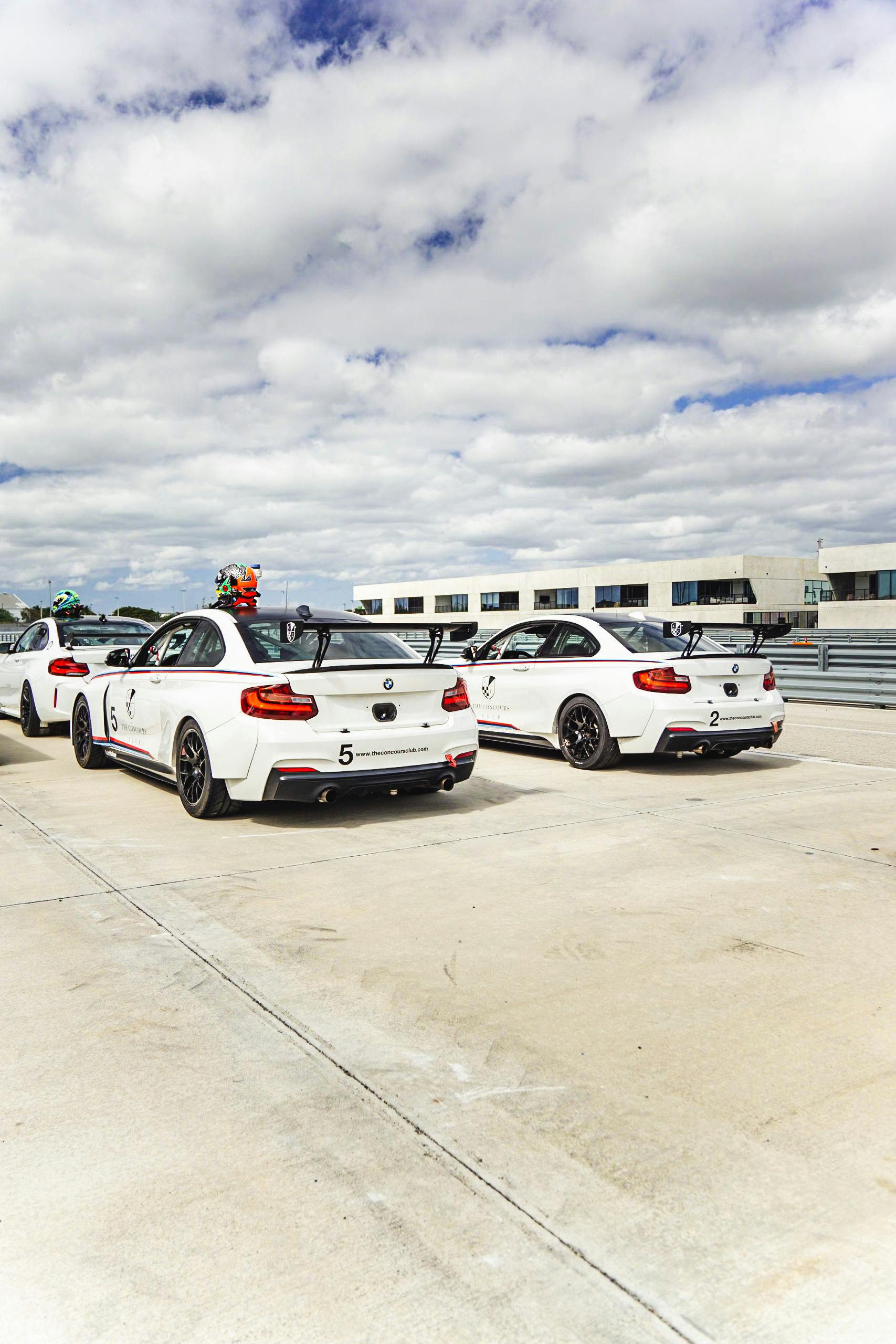 White BMW Cars on a Track · Free Stock Photo