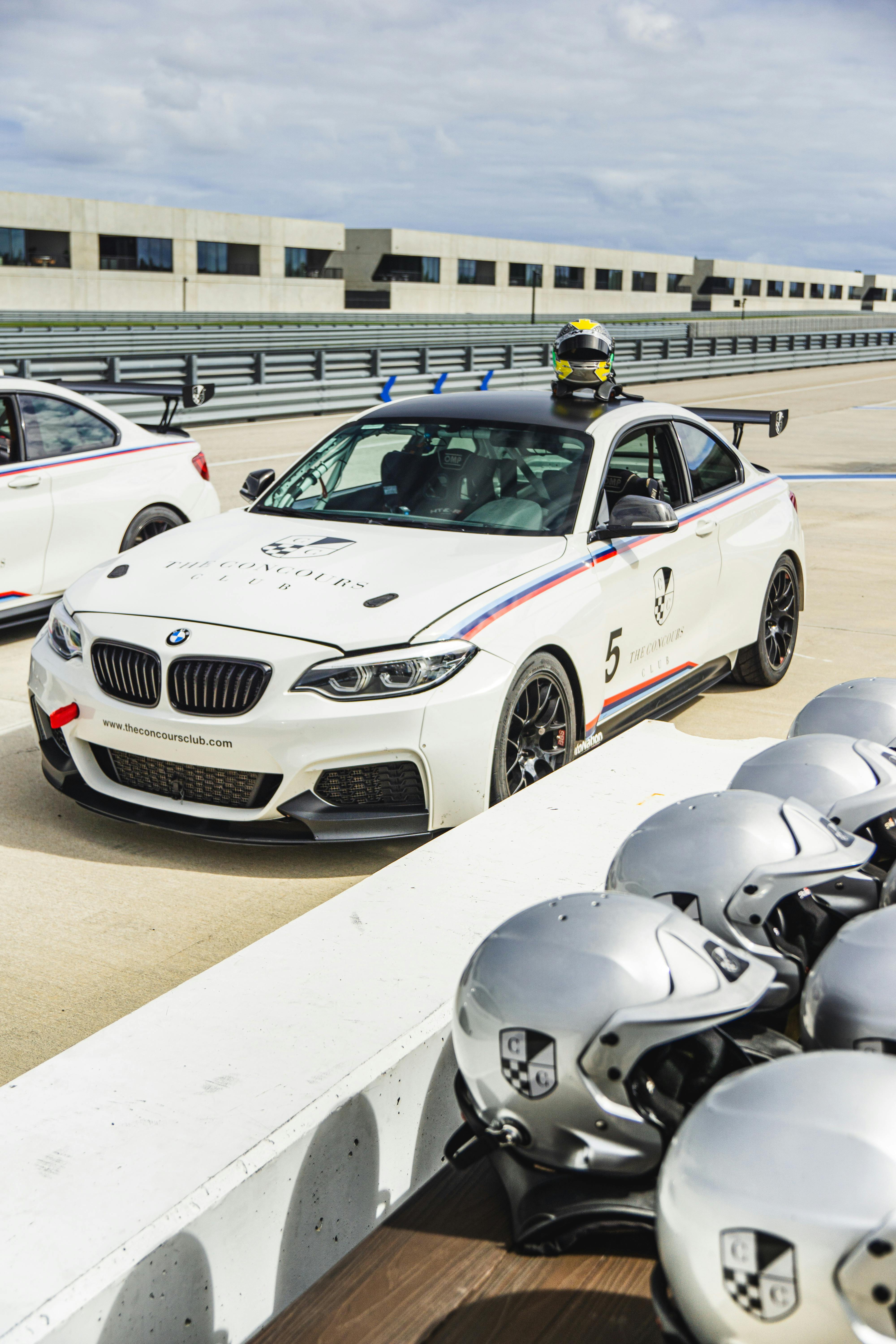 Racing BMW M235i Car in Pit Lane · Free Stock Photo