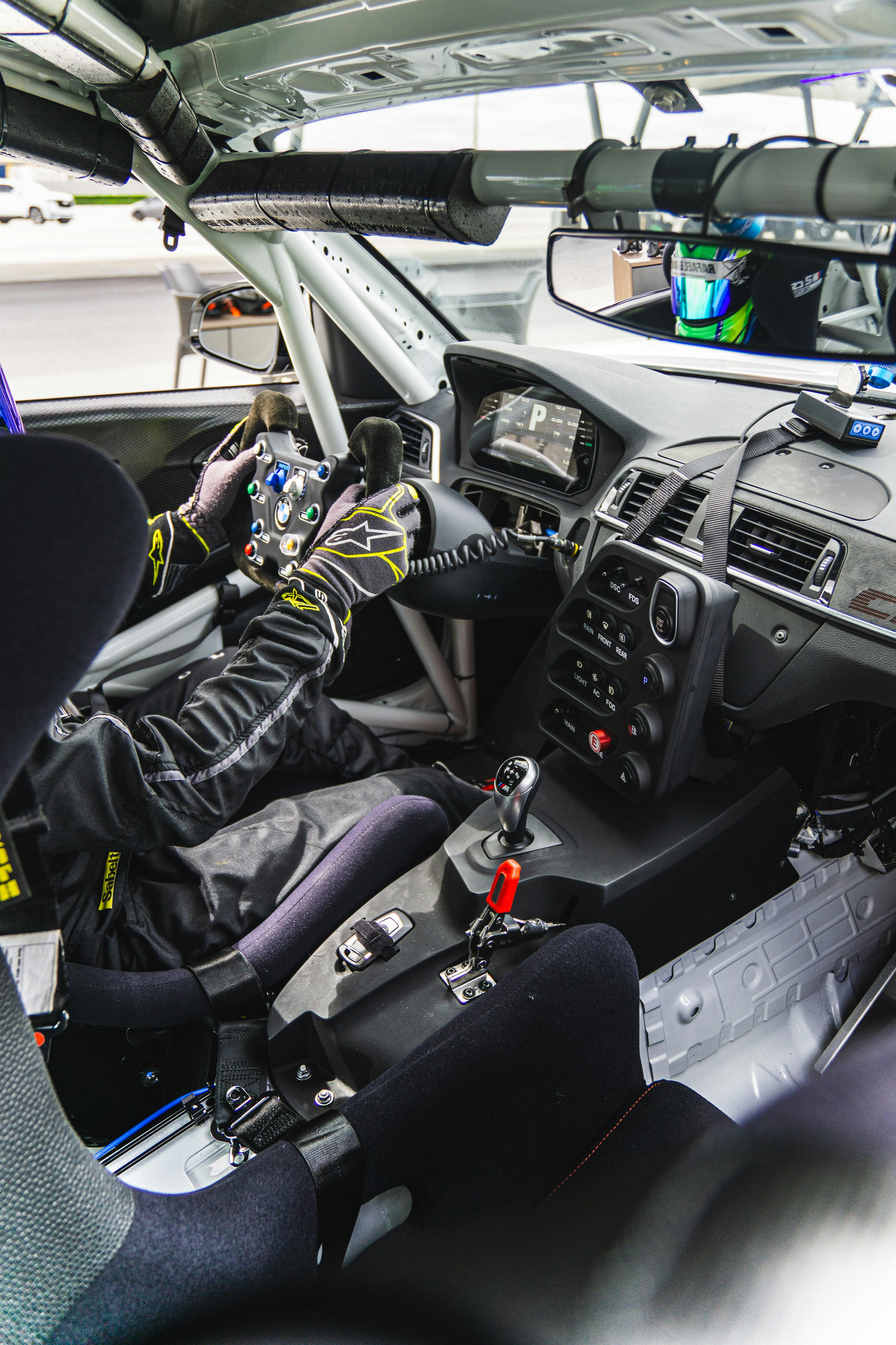 Racing Driver Sitting in Car · Free Stock Photo