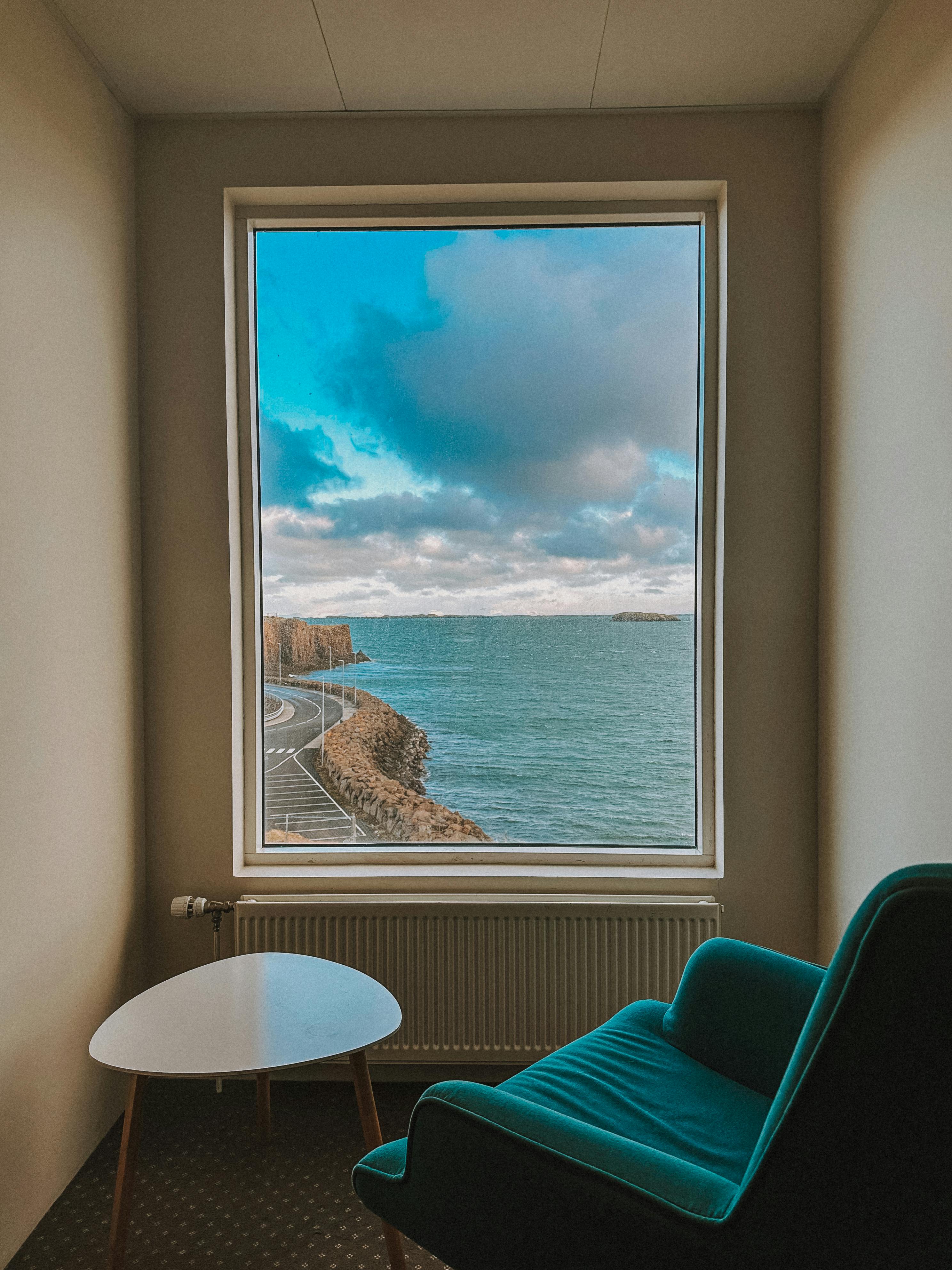 A Small Room with a Window View of Sea · Free Stock Photo