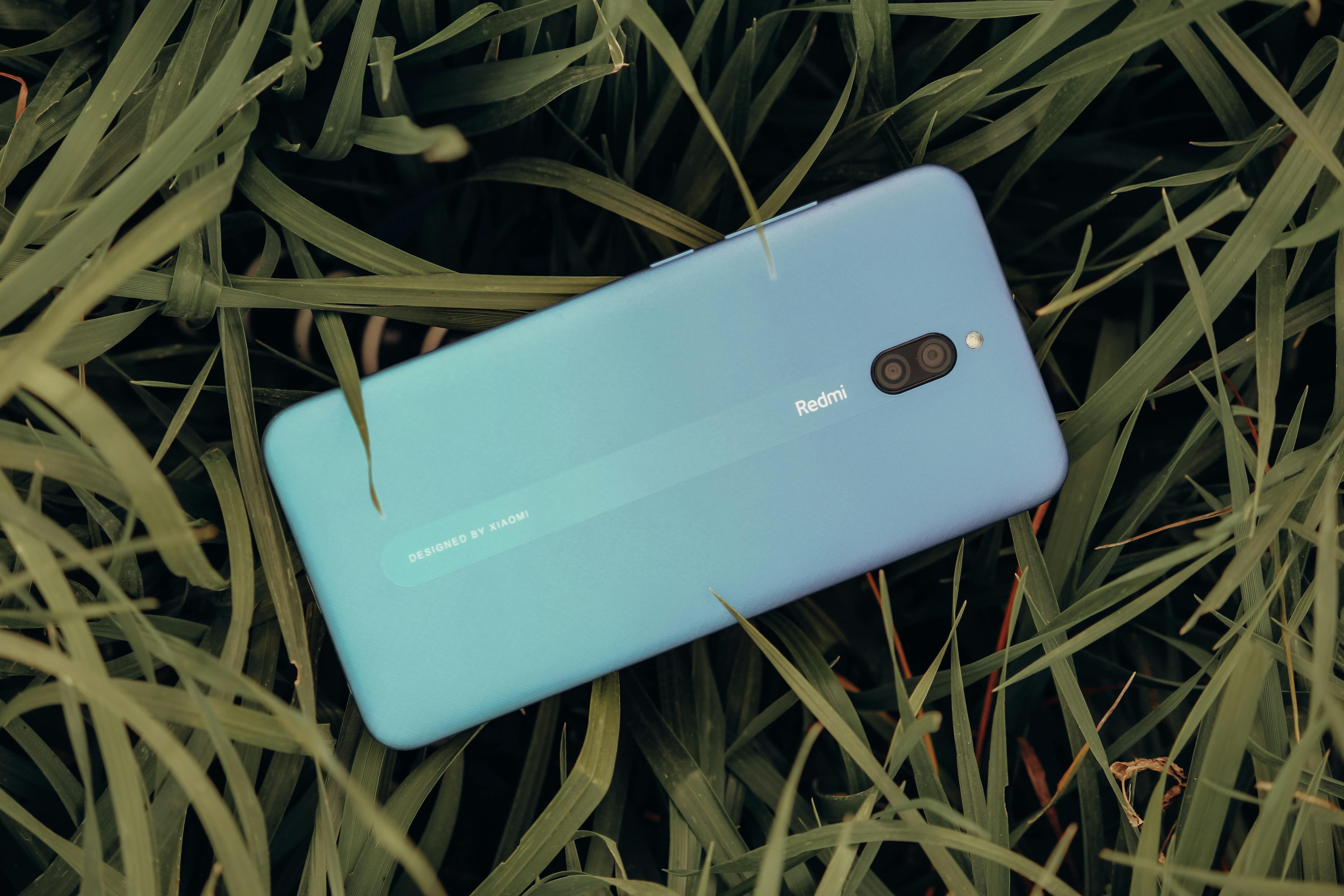 Blue Smartphone in Grass · Free Stock Photo