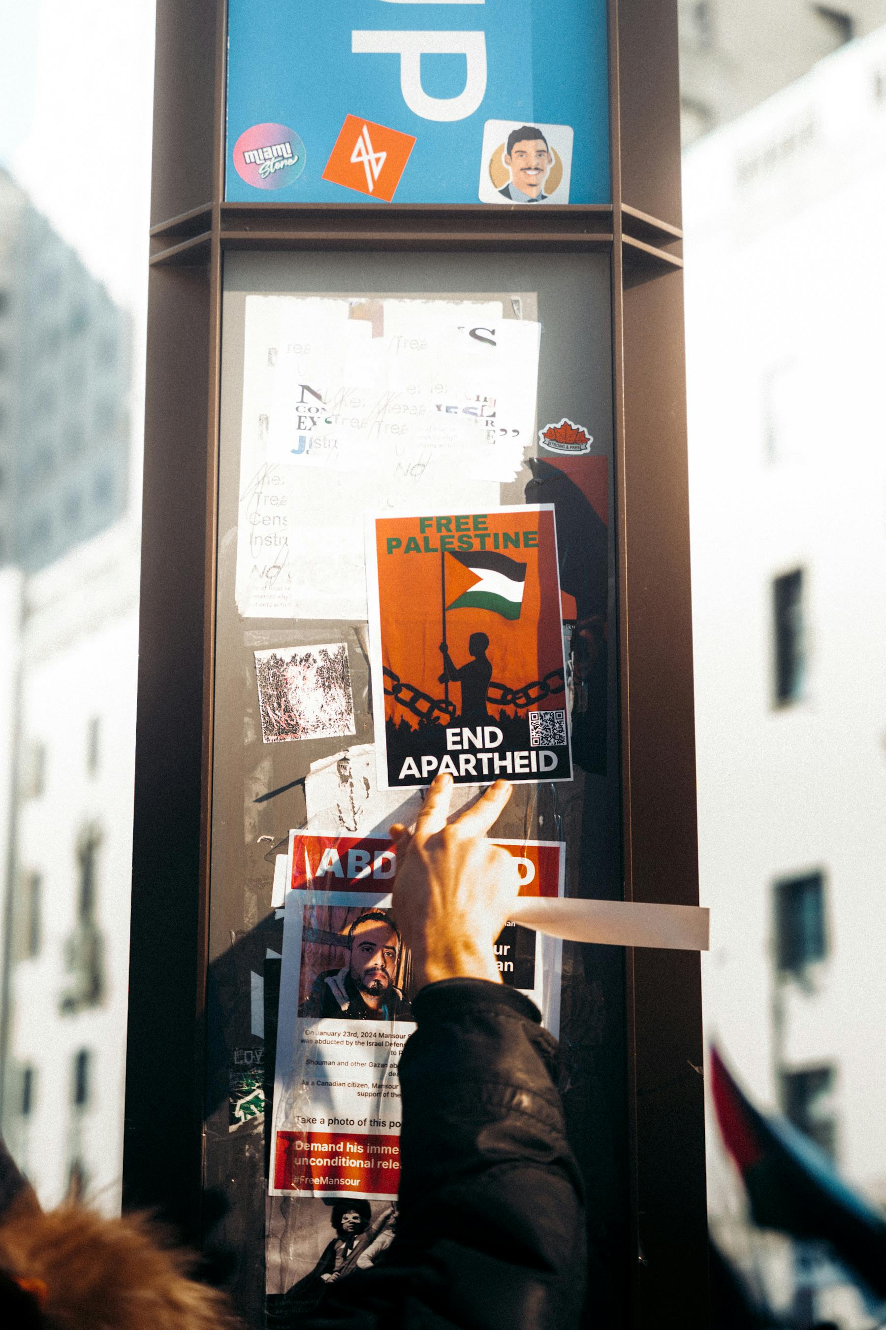 Street pole with colorful stickers · Free Stock Photo