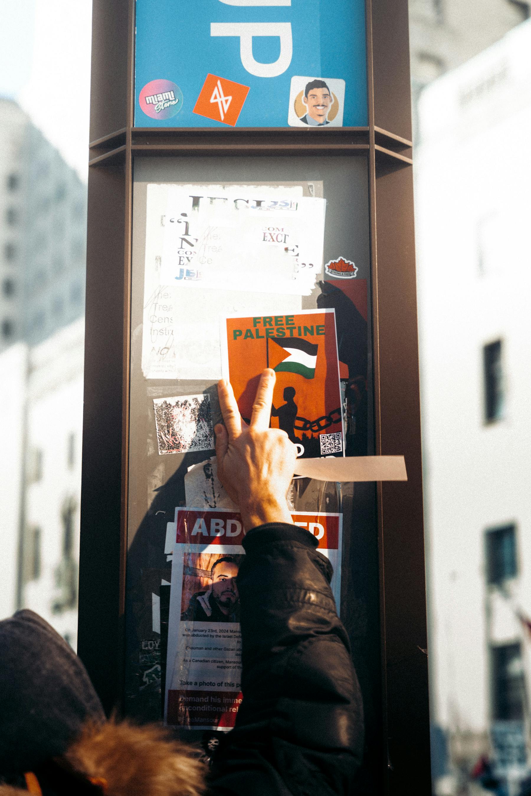 Street pole with colorful stickers · Free Stock Photo